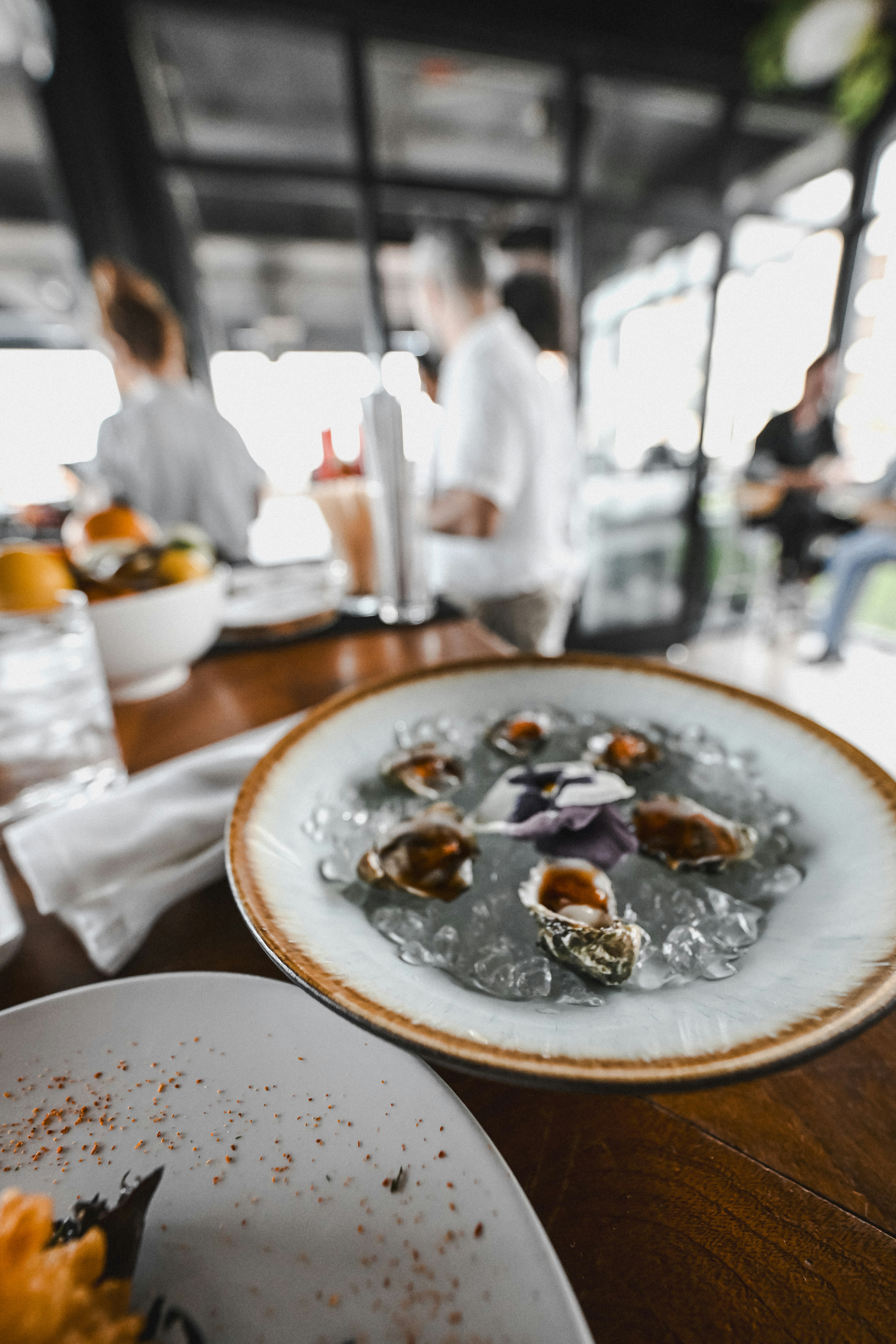 Gleaming plate centerpiece: seafood pearls on a textured ceramic dish
