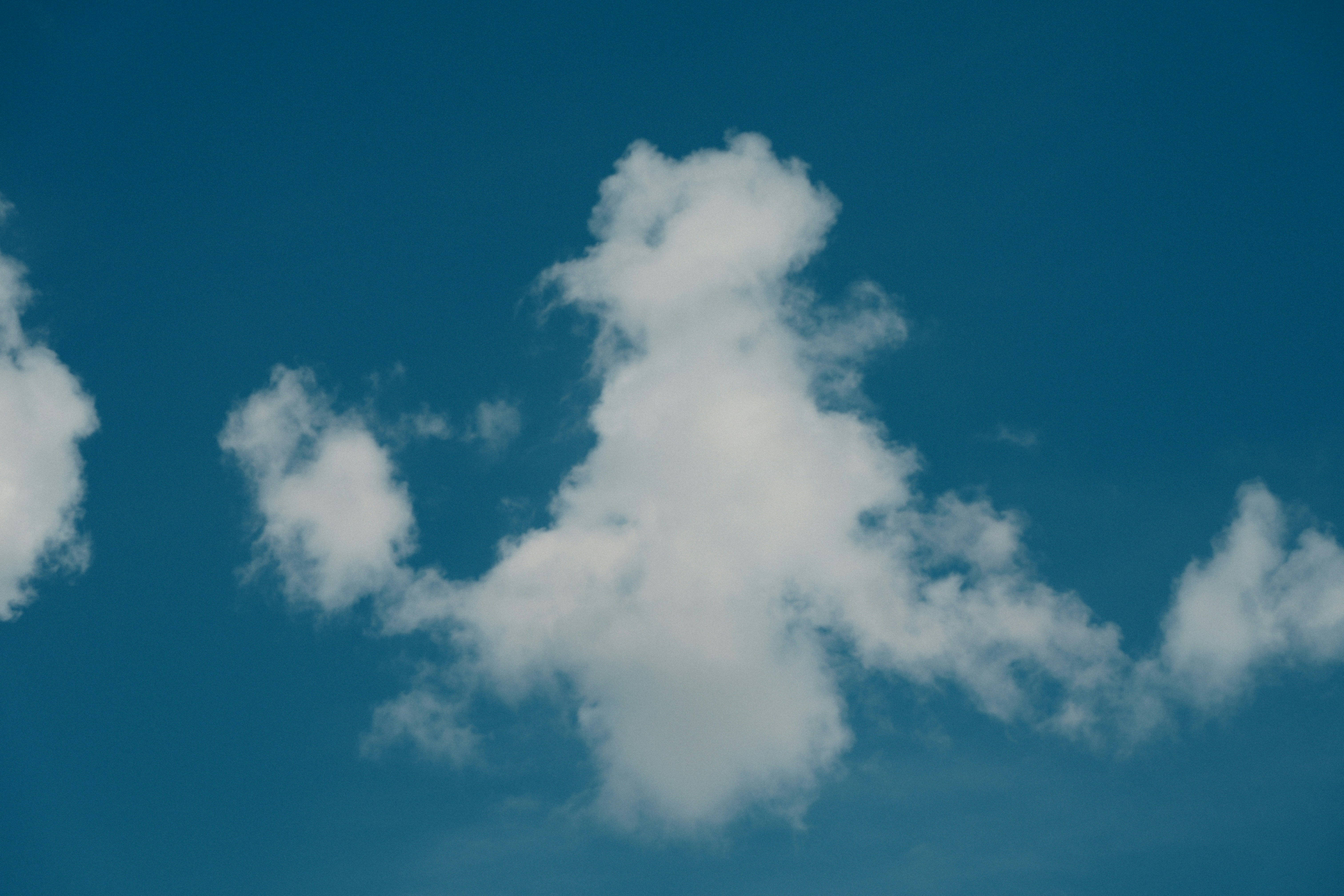 Cloud Collision in a Clear Blue Canvas