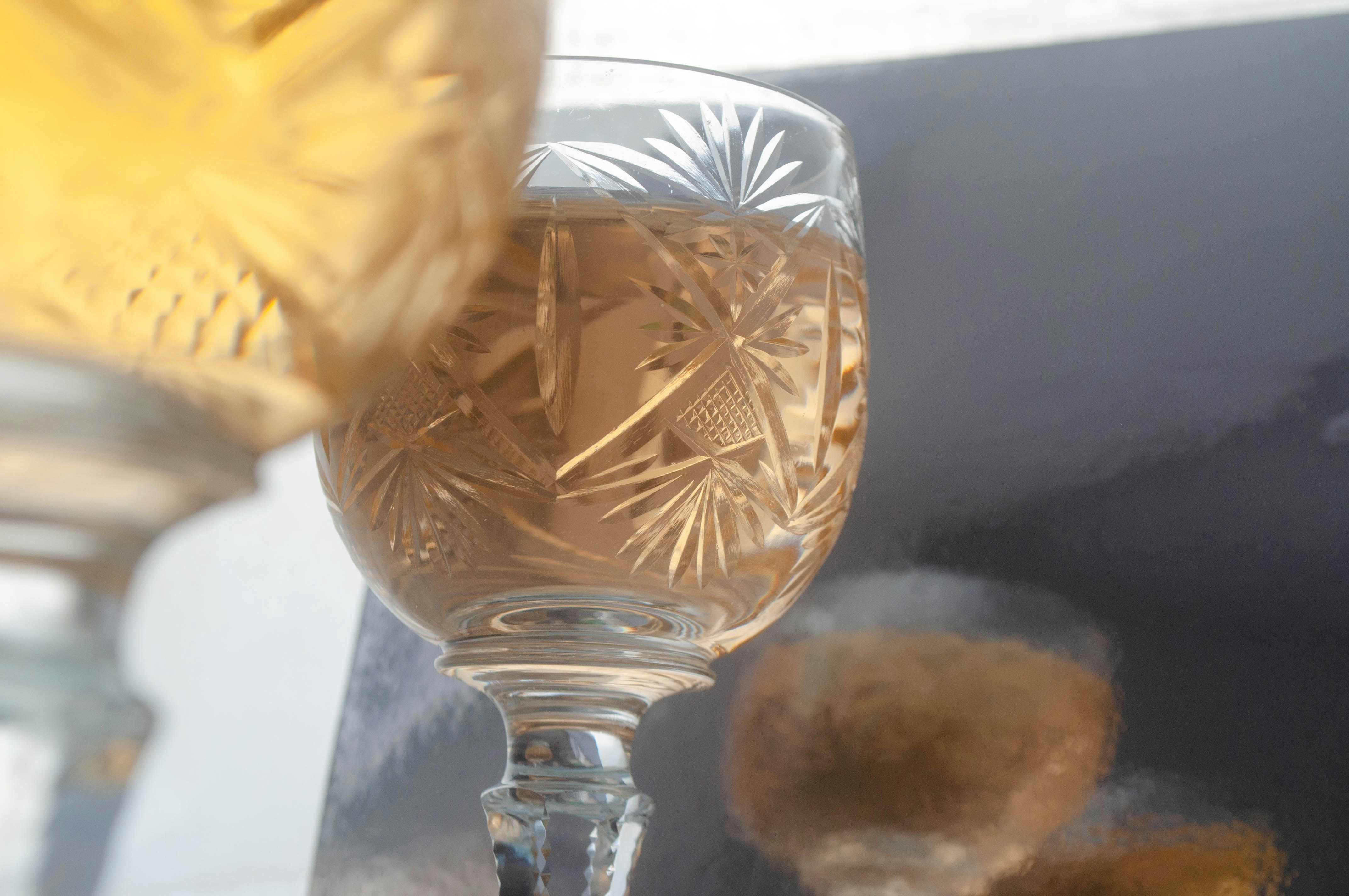 Crystal Glass Portrait: A Delicate Toast in Soft Backlight