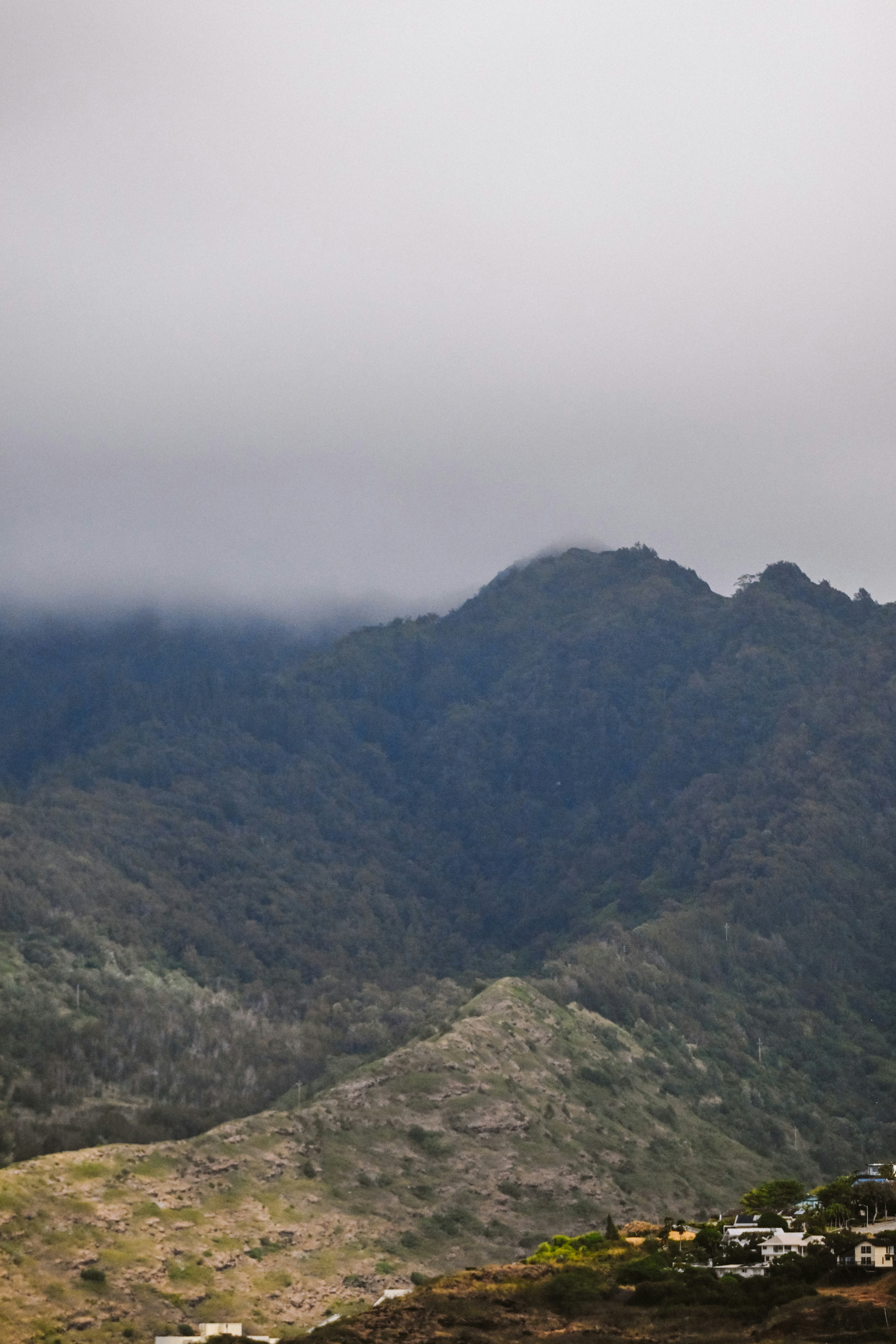 Ridgeline Quiet: A hillside village tucked along the shadowed escarpment