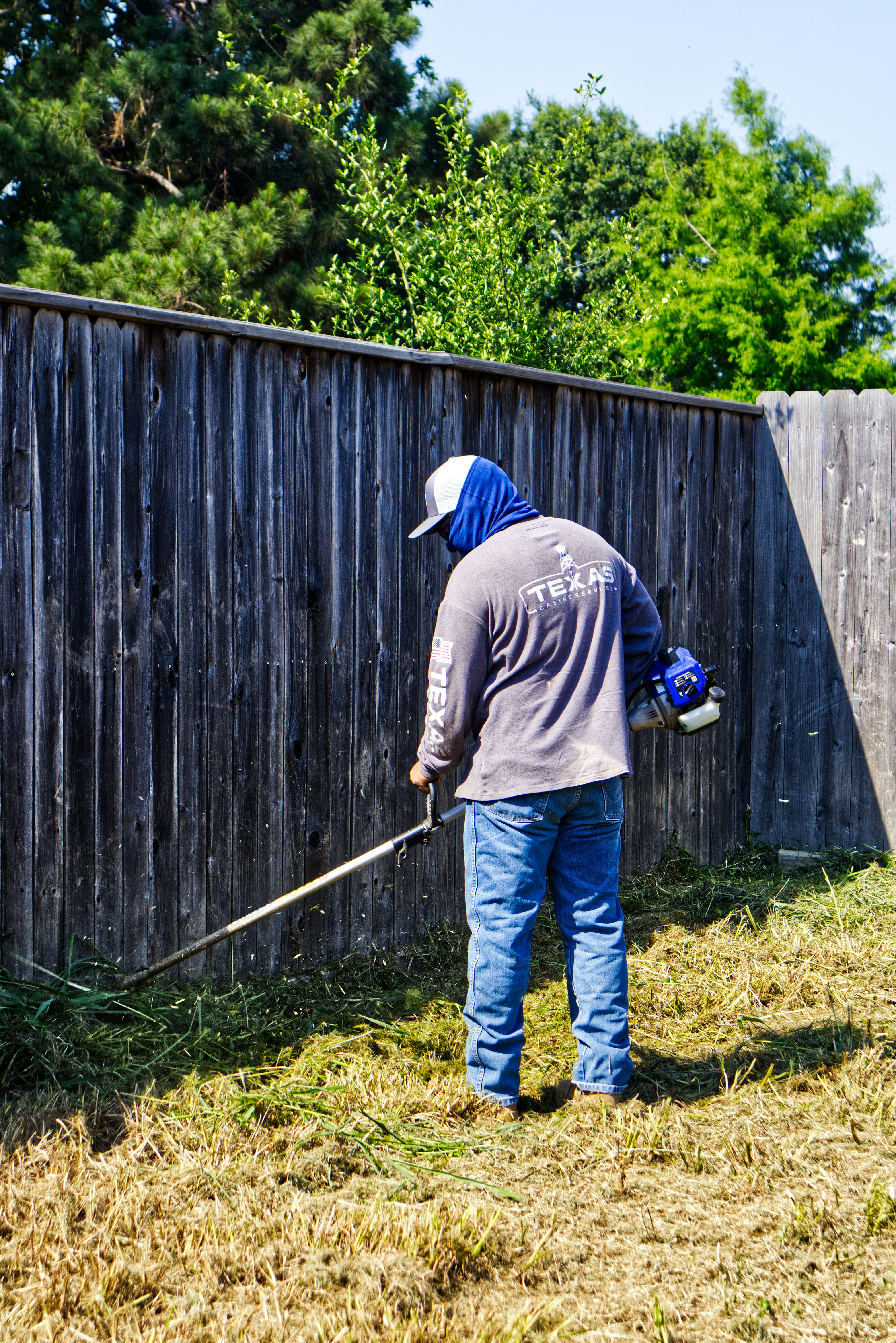 Lawn-mowing crew performing a lawn care service.