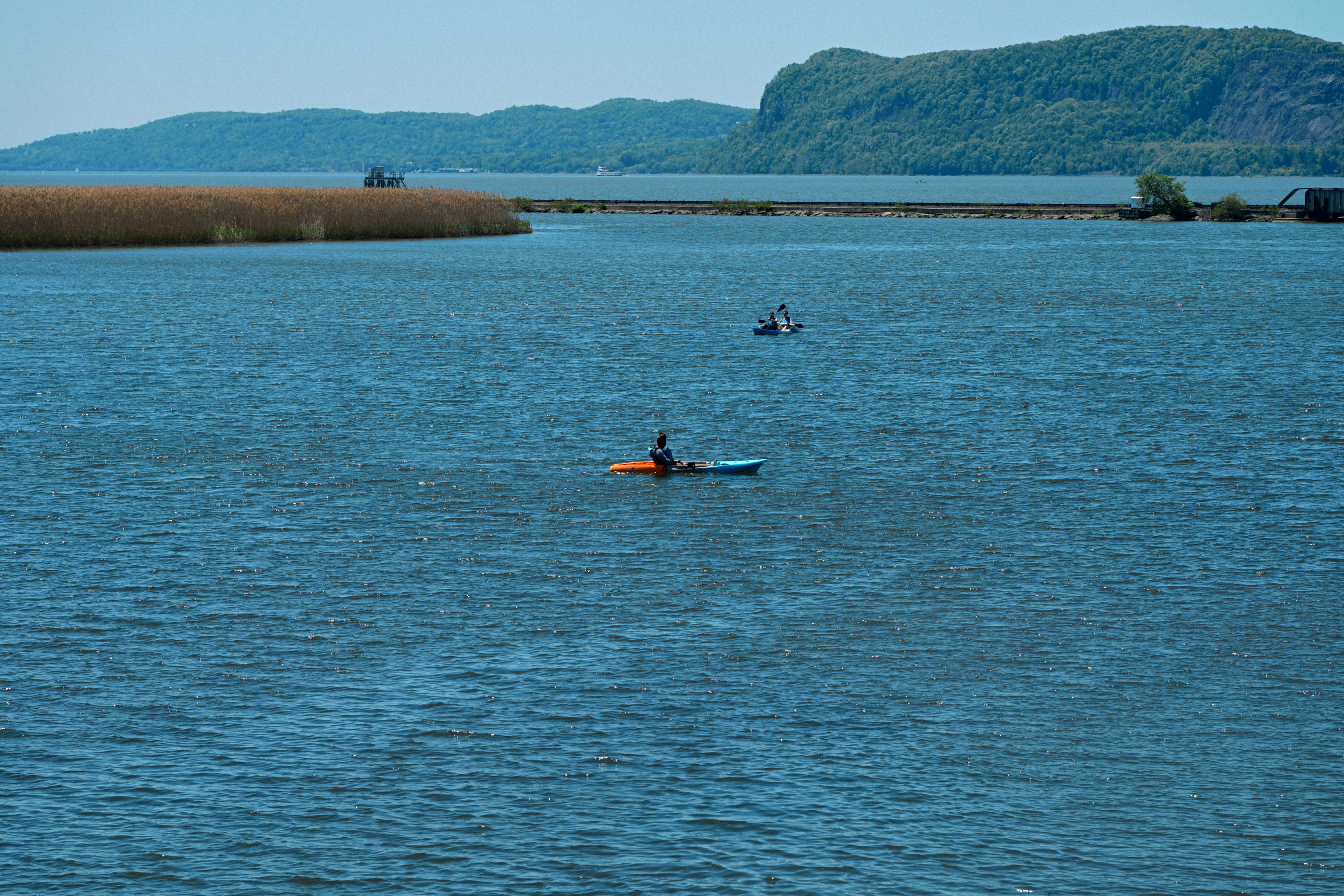 Distant Canoeists on a Blue Expanse