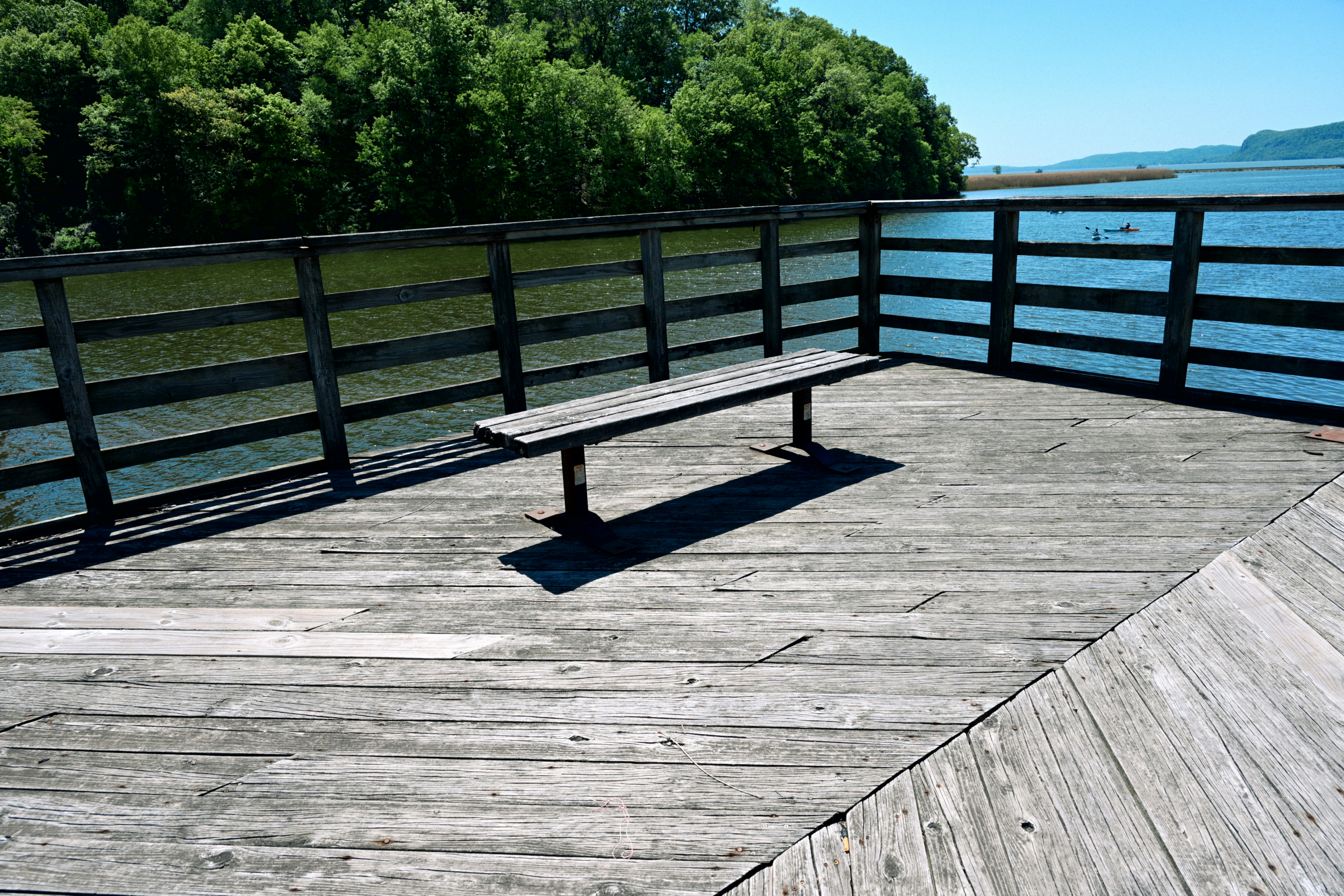 Bench at the Edge: A Quiet Promenade Over Calm Water