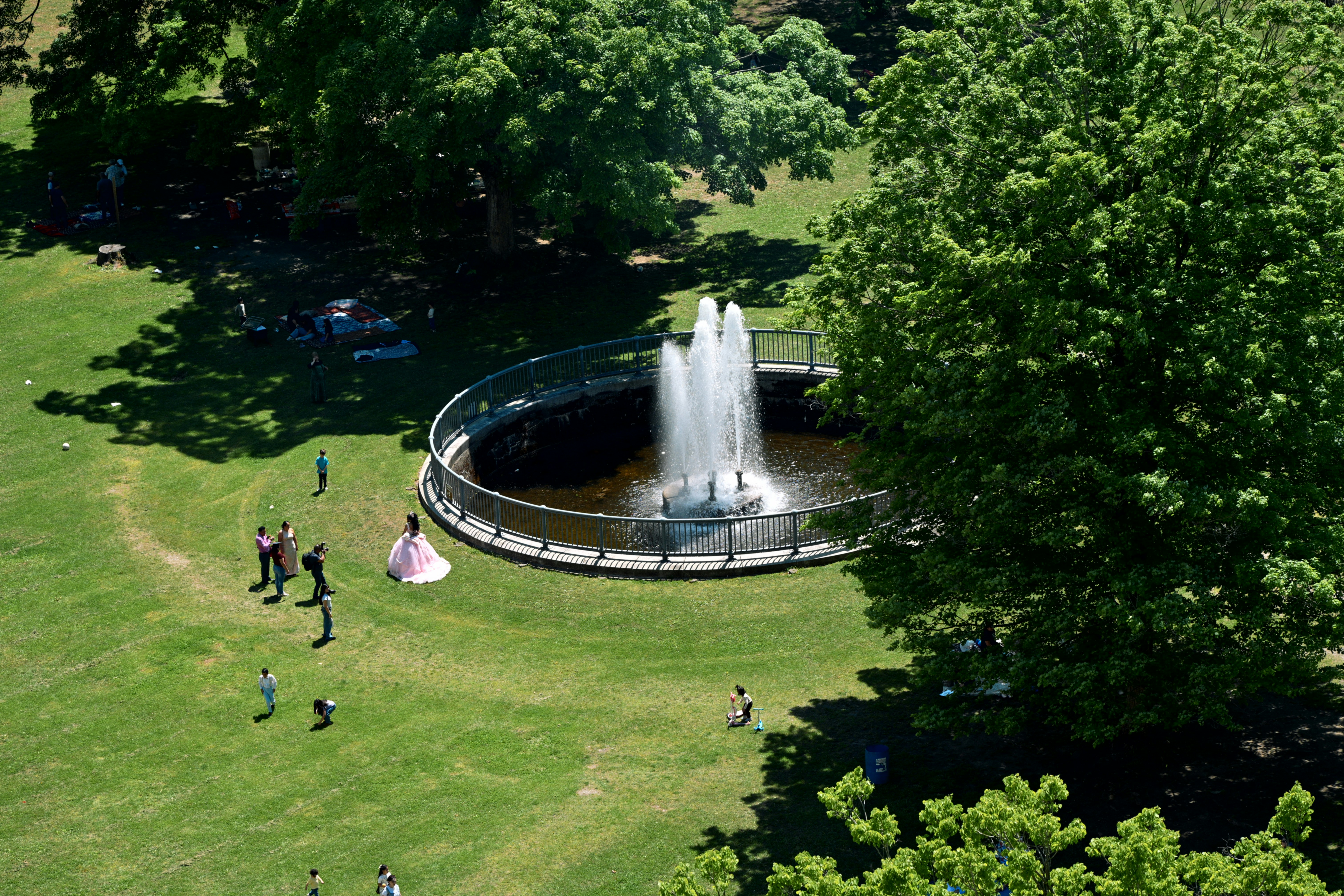 Aerial View: Central fountain within a sunlit park circle