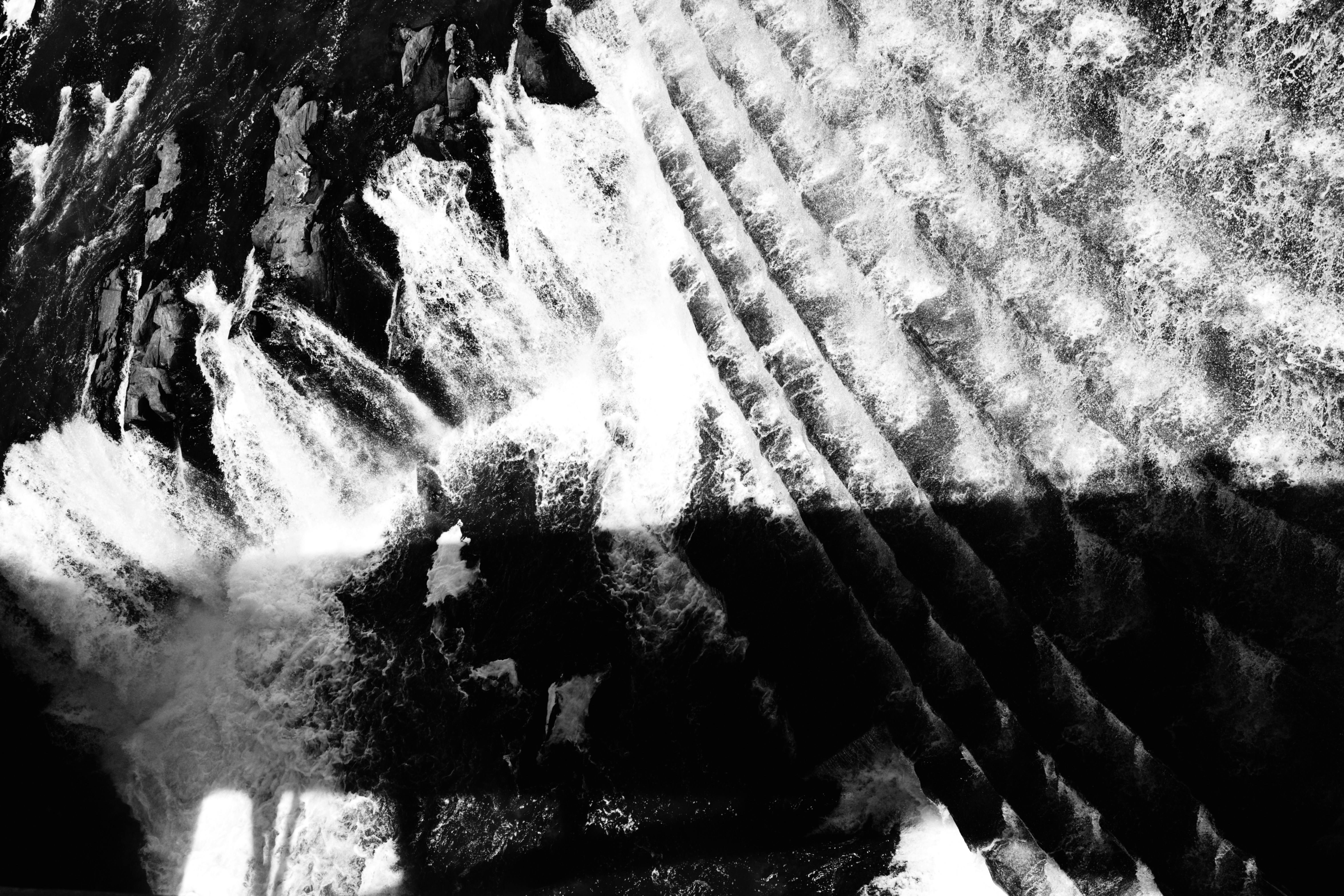 Crystalline Abrasion: A Tangle of Light and Shadow on Ice-black Striations