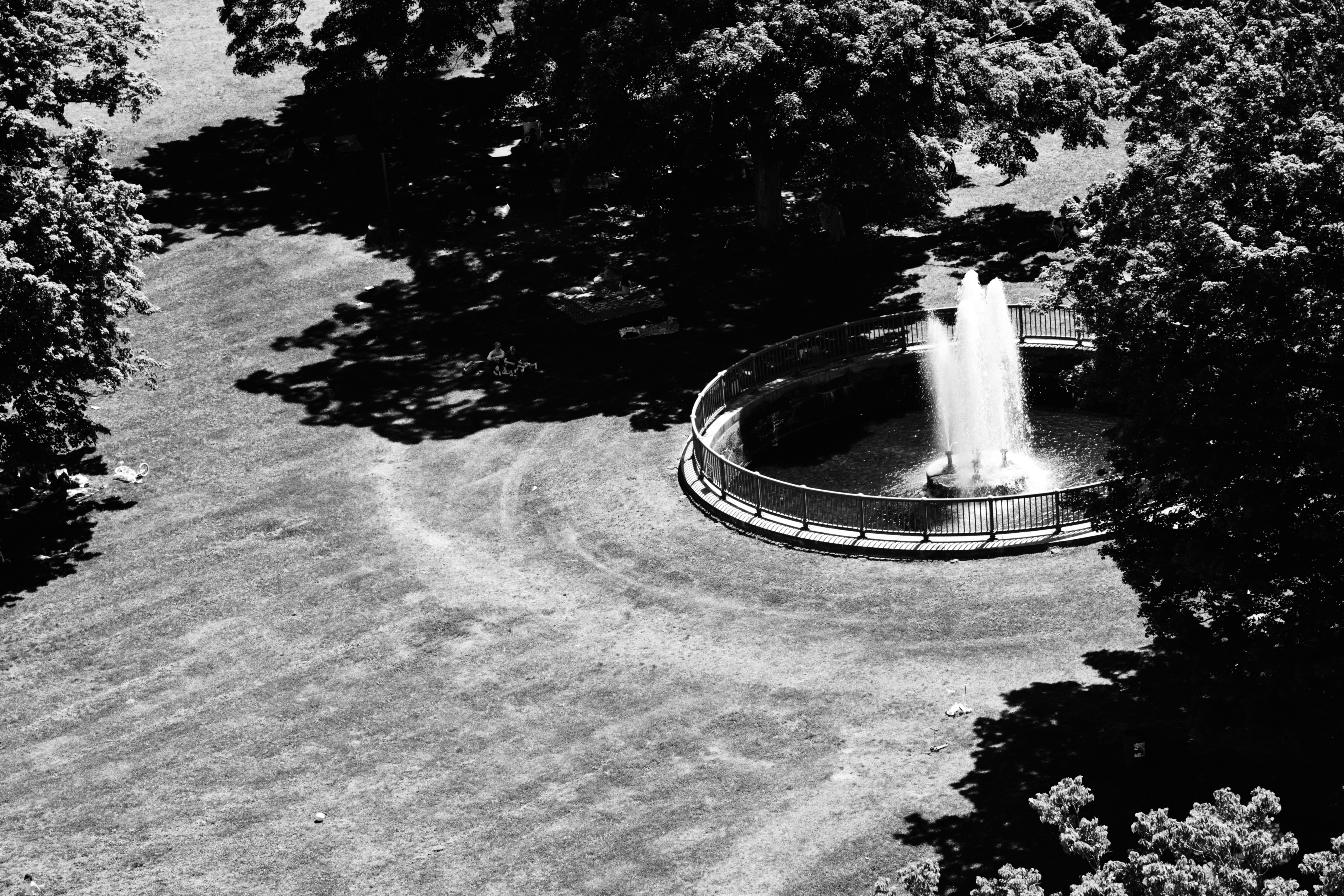 Circular Fountain in a Sunlit Park — A Quiet Aerial View