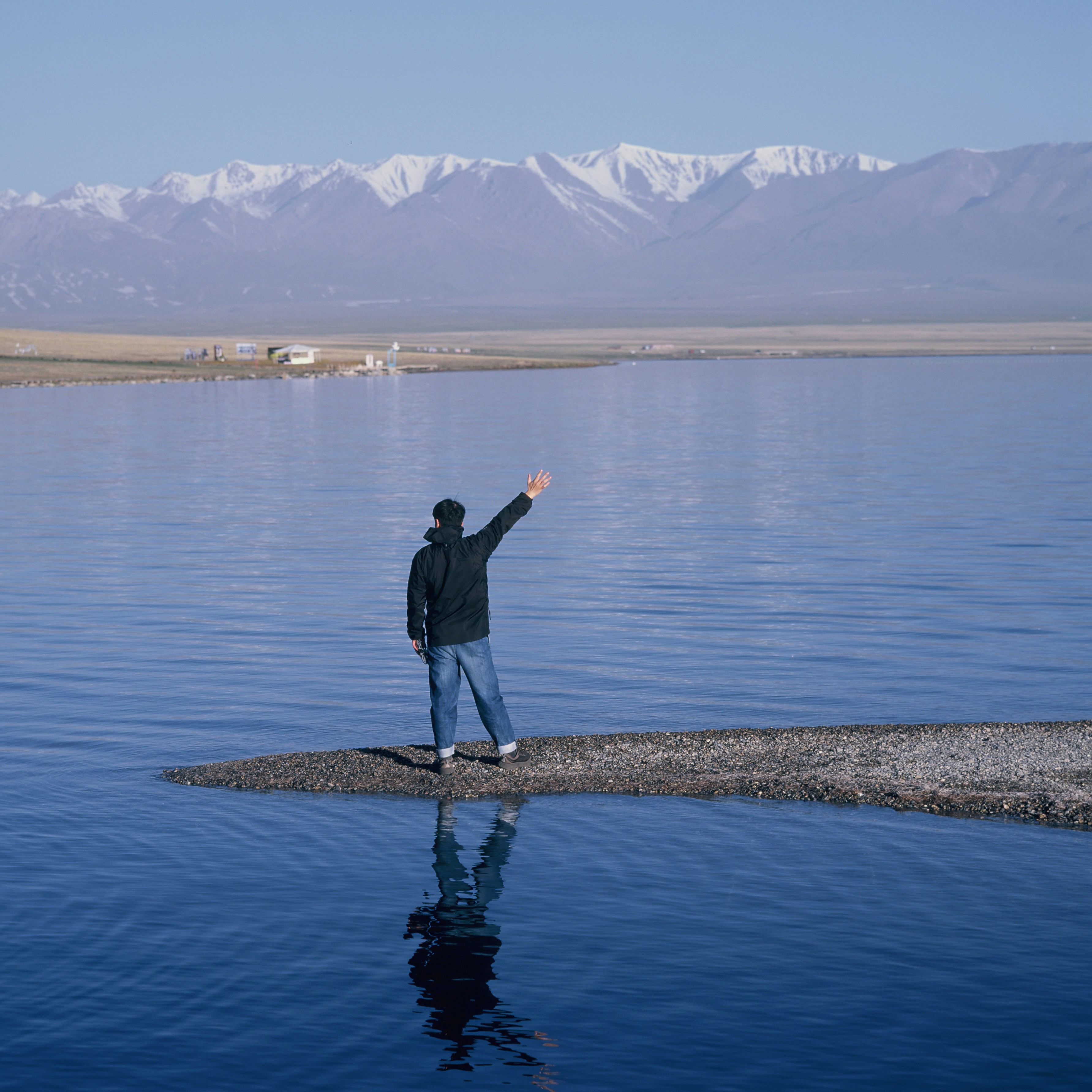 Solitary Gesture at the Edge of Quiet Waters