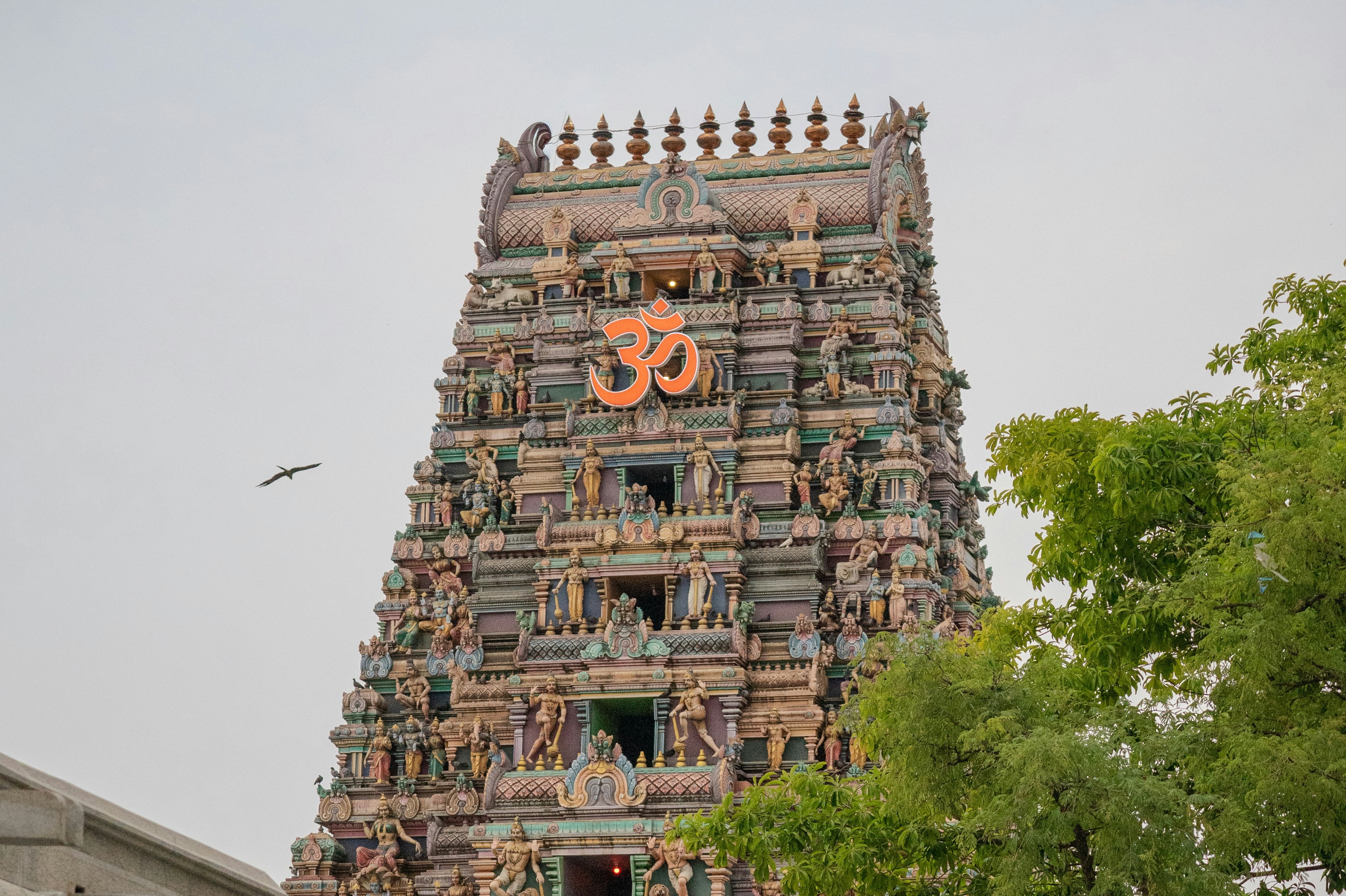Om Script Tower: The Venerable Hindu Temple Gopuram with the Sacred Om