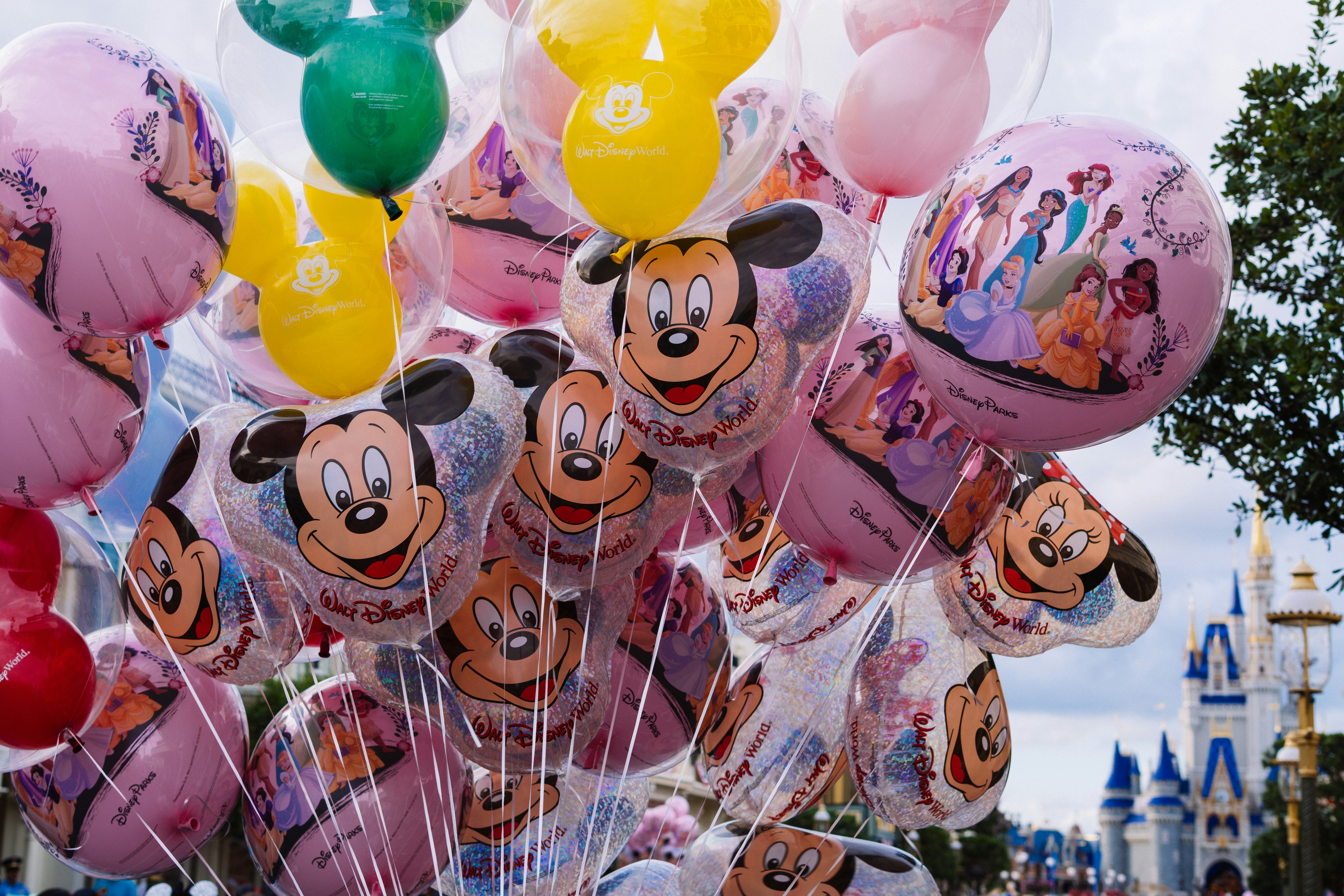 Mickey Balloon Parade: A Burst of Color Over a Fairy-Tale Castle