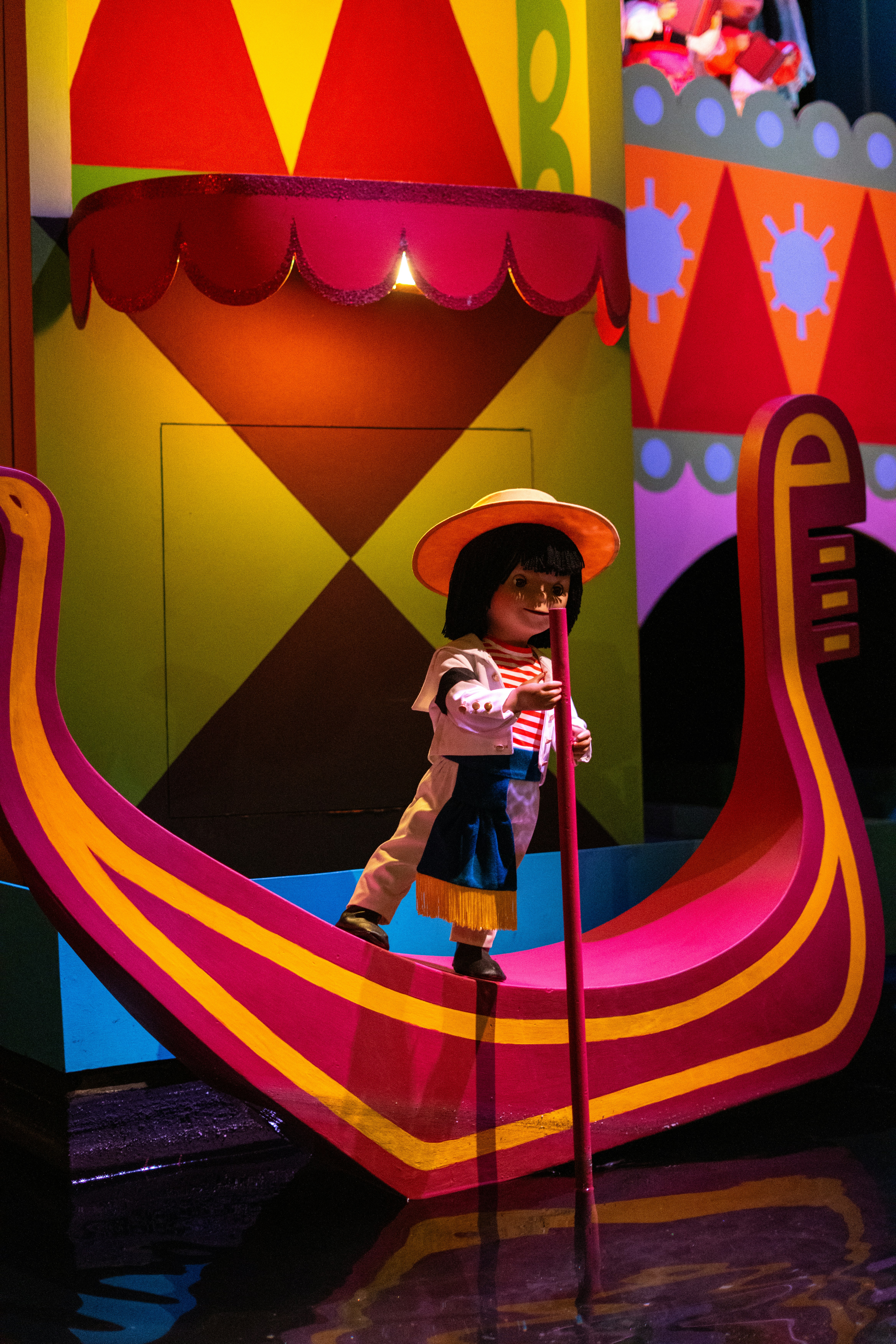Masked Traveler: A Dainty Figure On a Carnival Canoe
