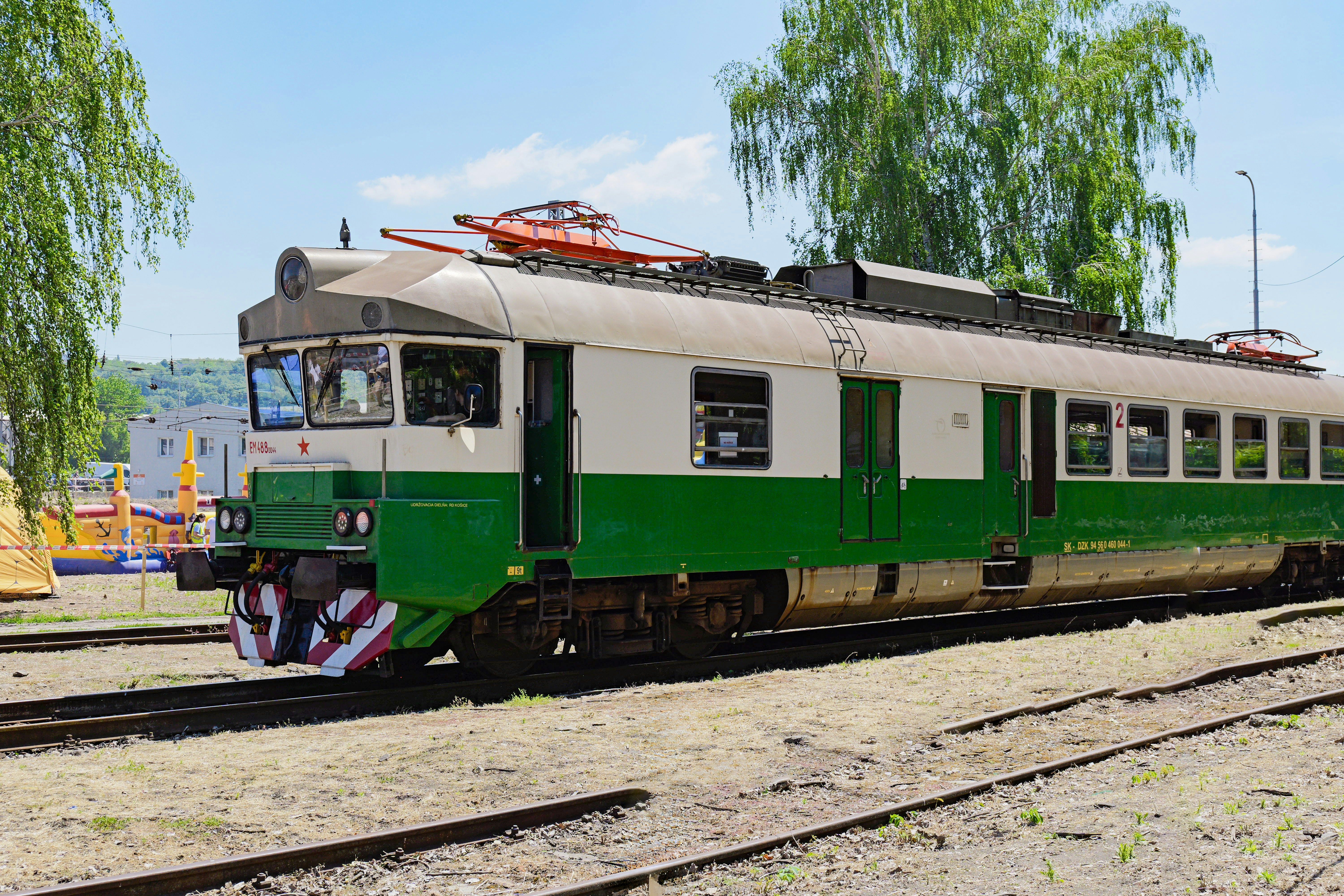 Green Locomotive on Rails: A Classic Train at Rest