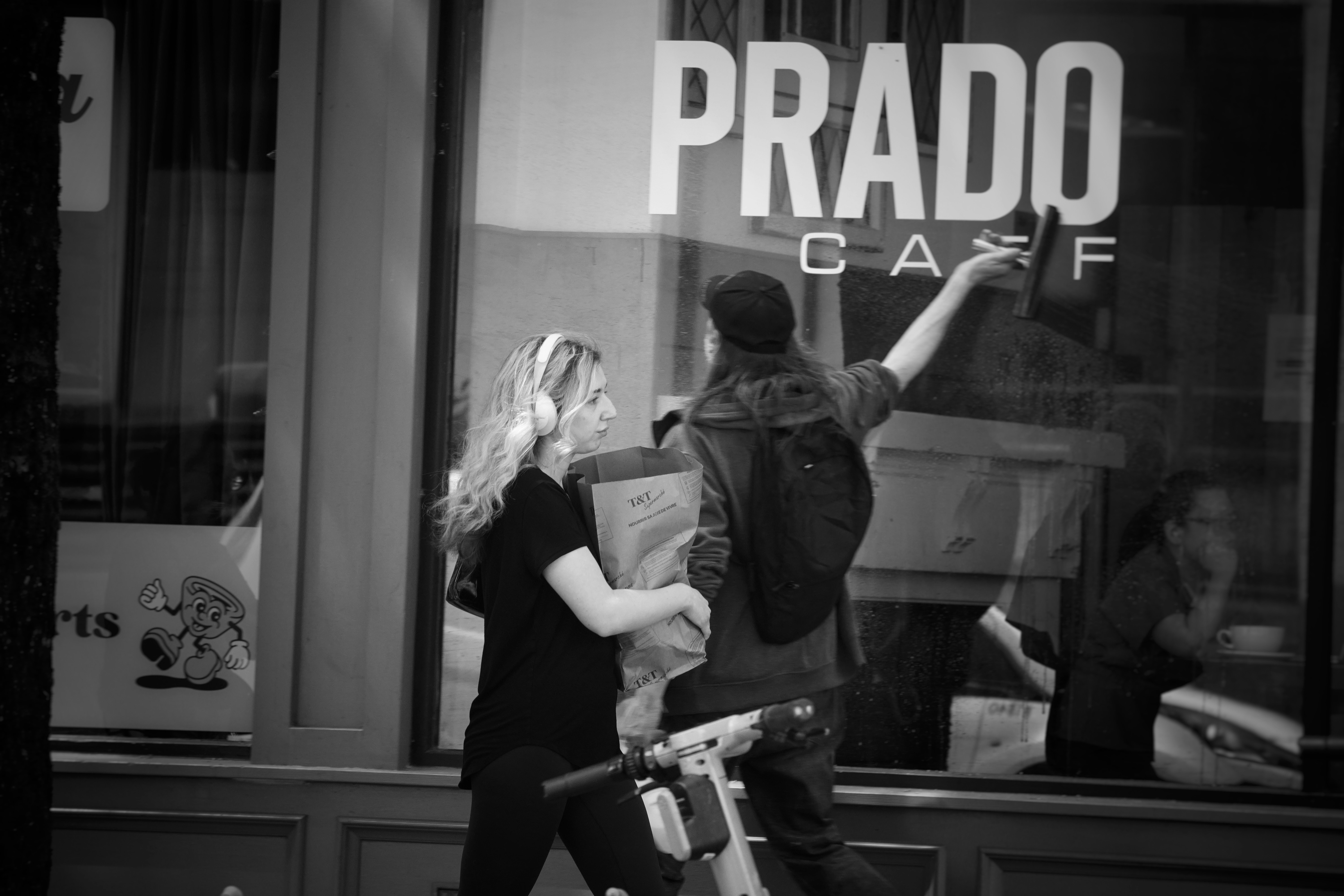 Motion Under Glass: A Street Moment at Prada Café