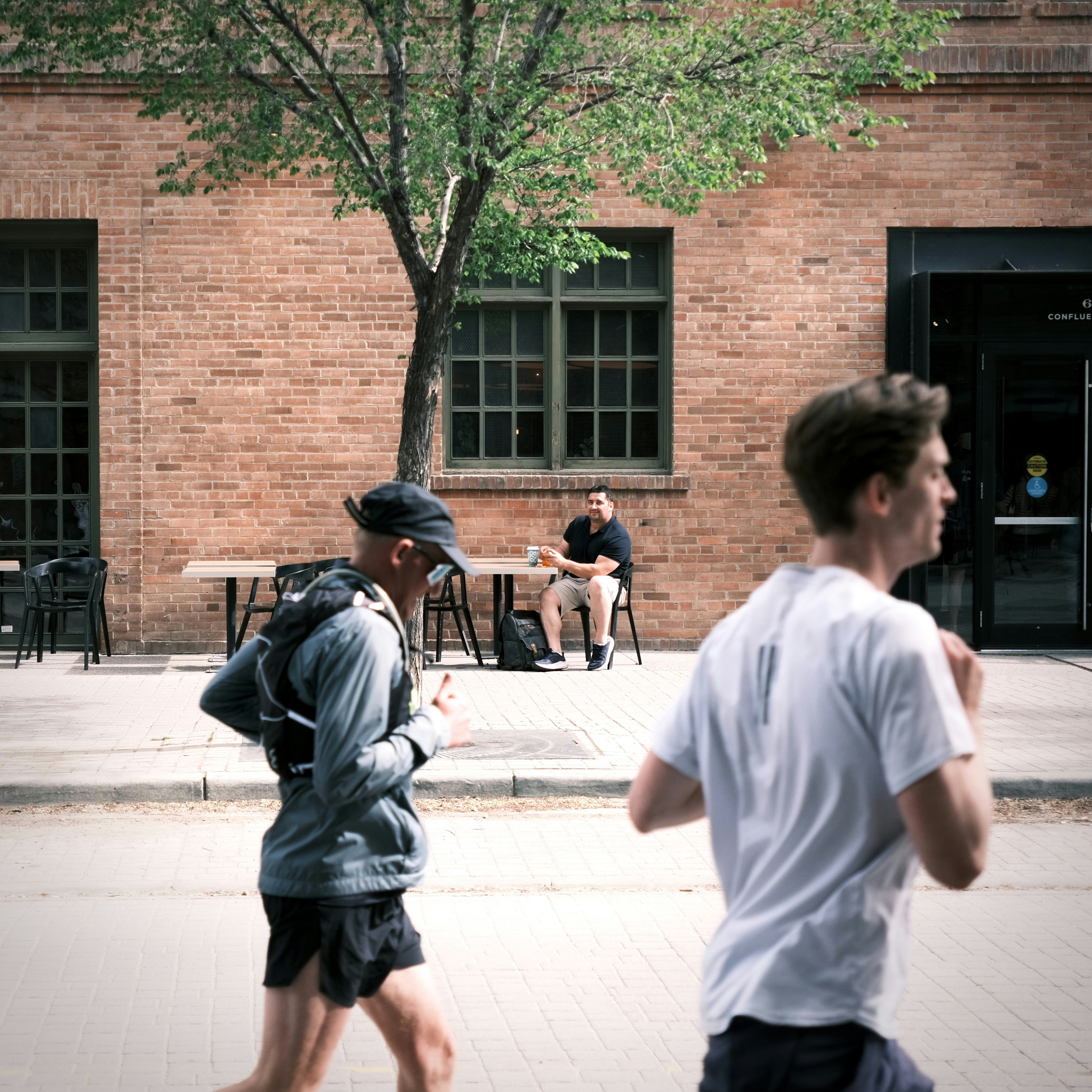 Cafe Terrace Run: A Quiet Moment Behind the Runners