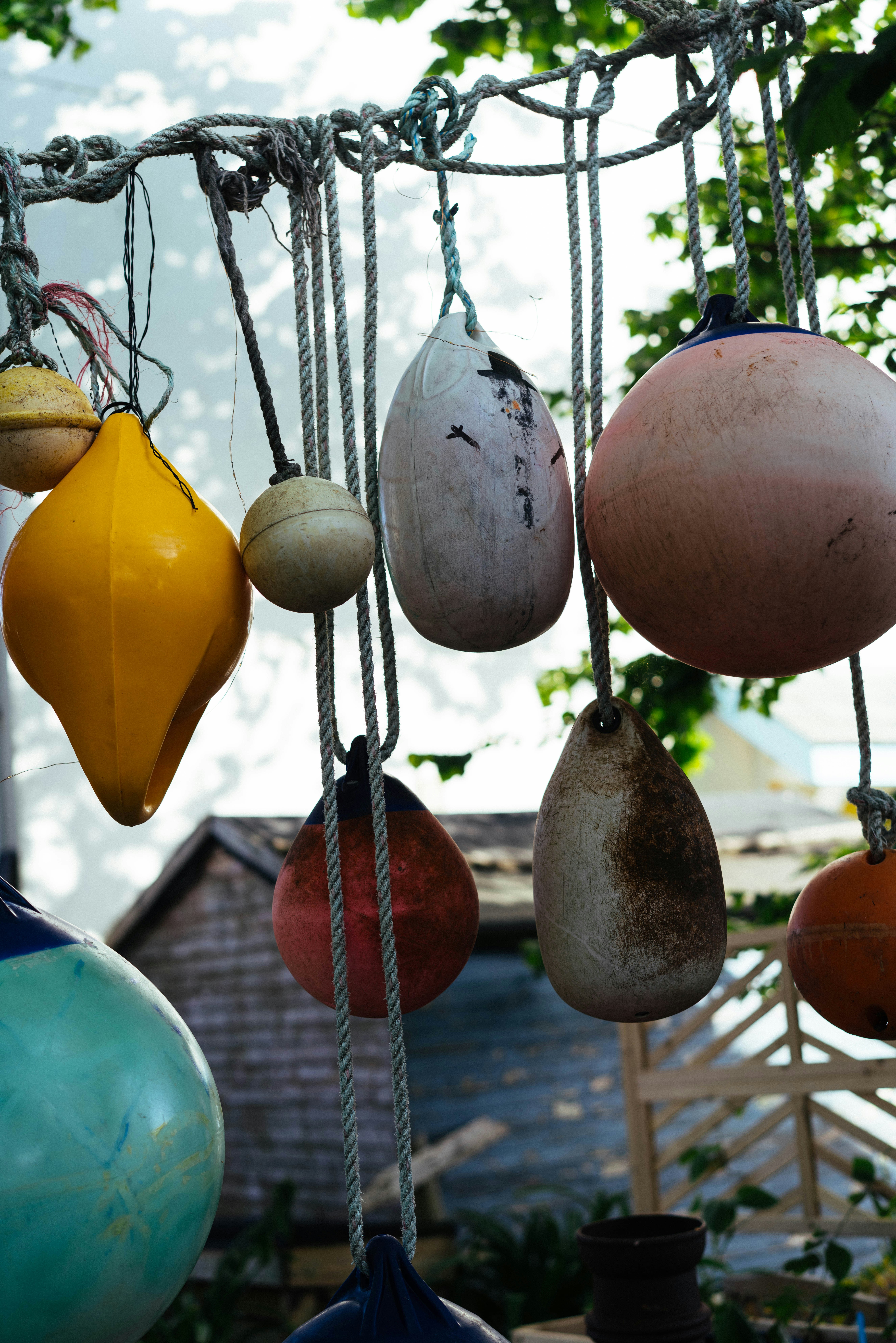 Strings of Painted Orbs: A Row of Weathered Buoy Balls