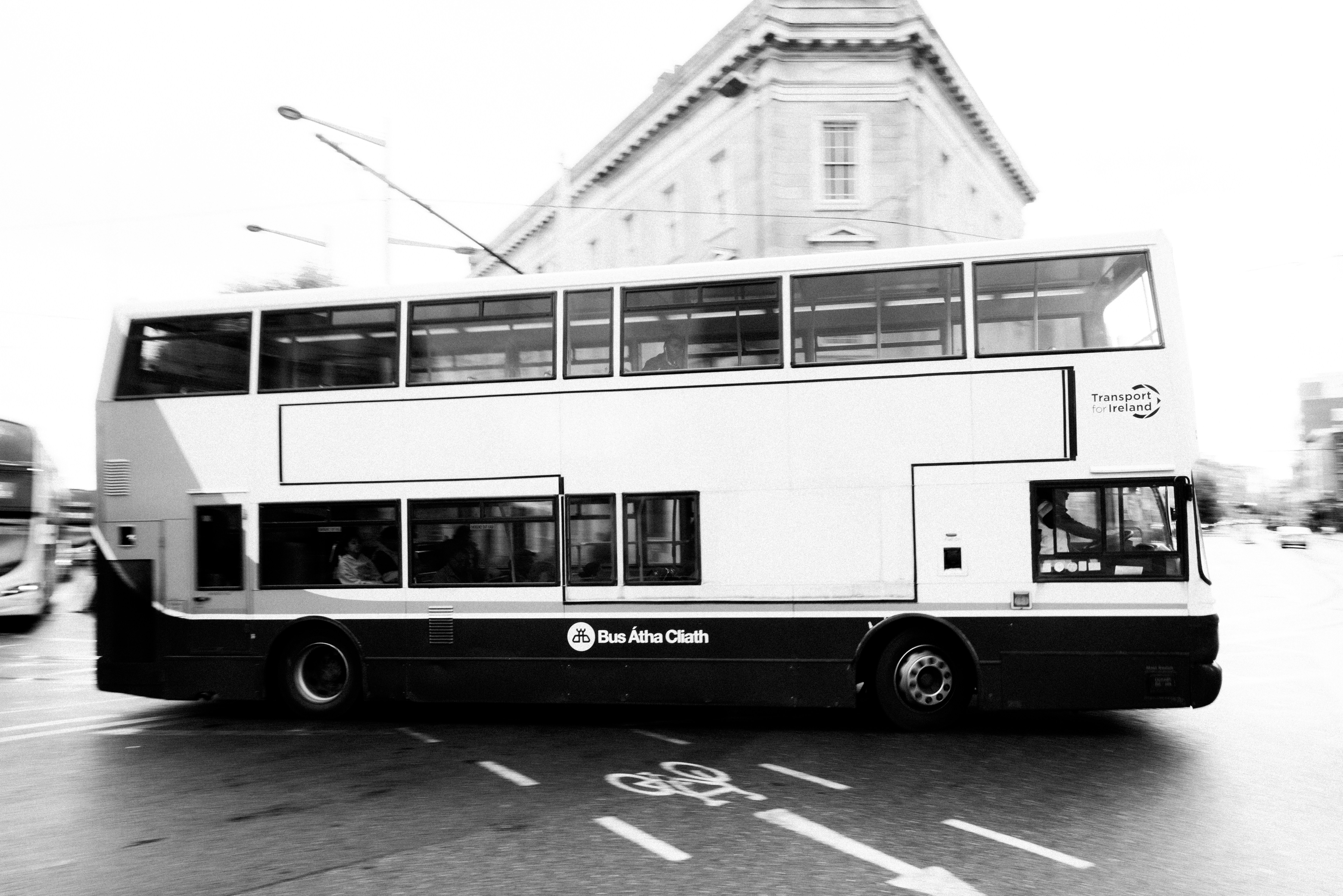 Urban Trajectory: A Double-Decker Stretches Across a Quiet Intersection