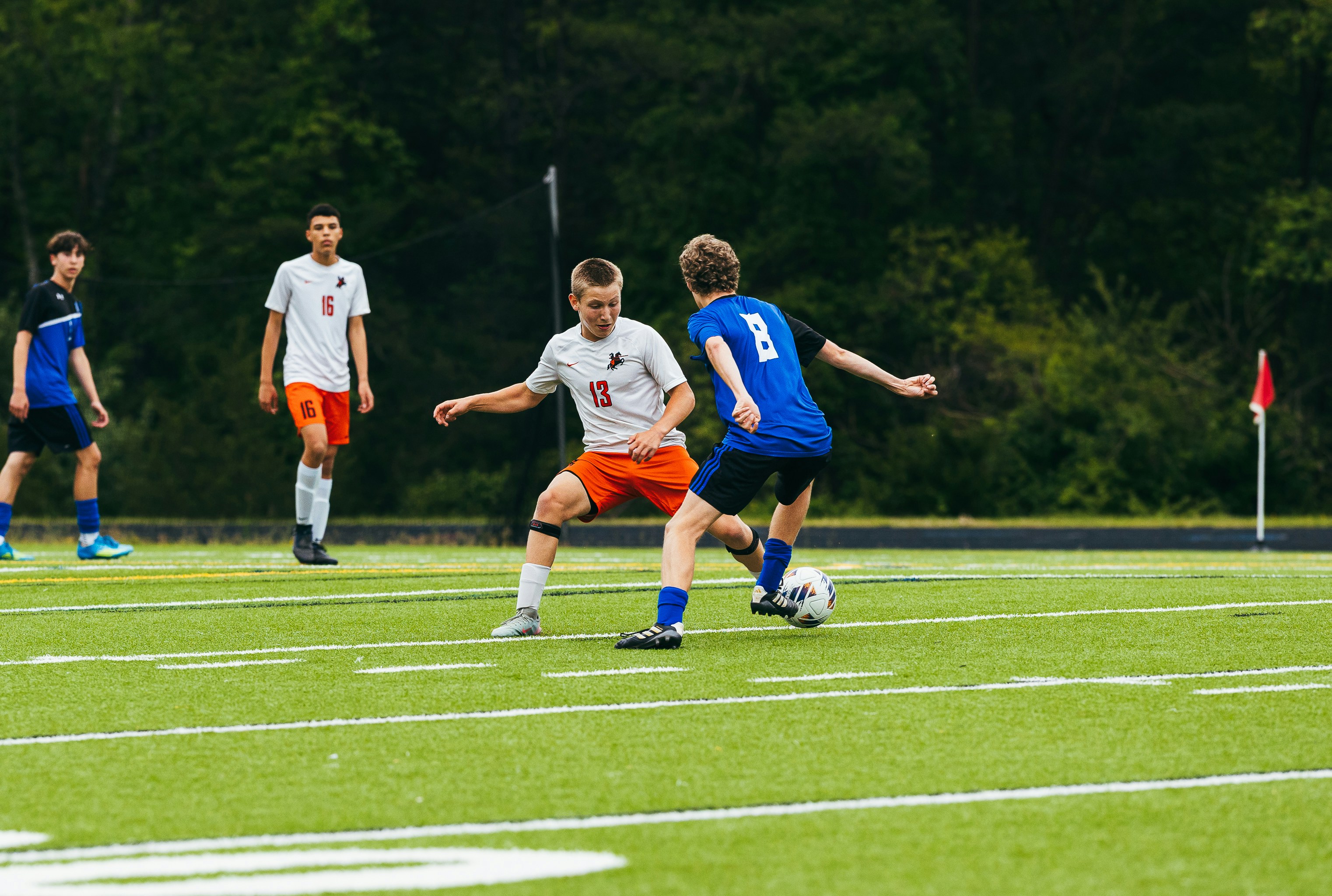Midfield Duel: A Fast Break on a Sunlit turf