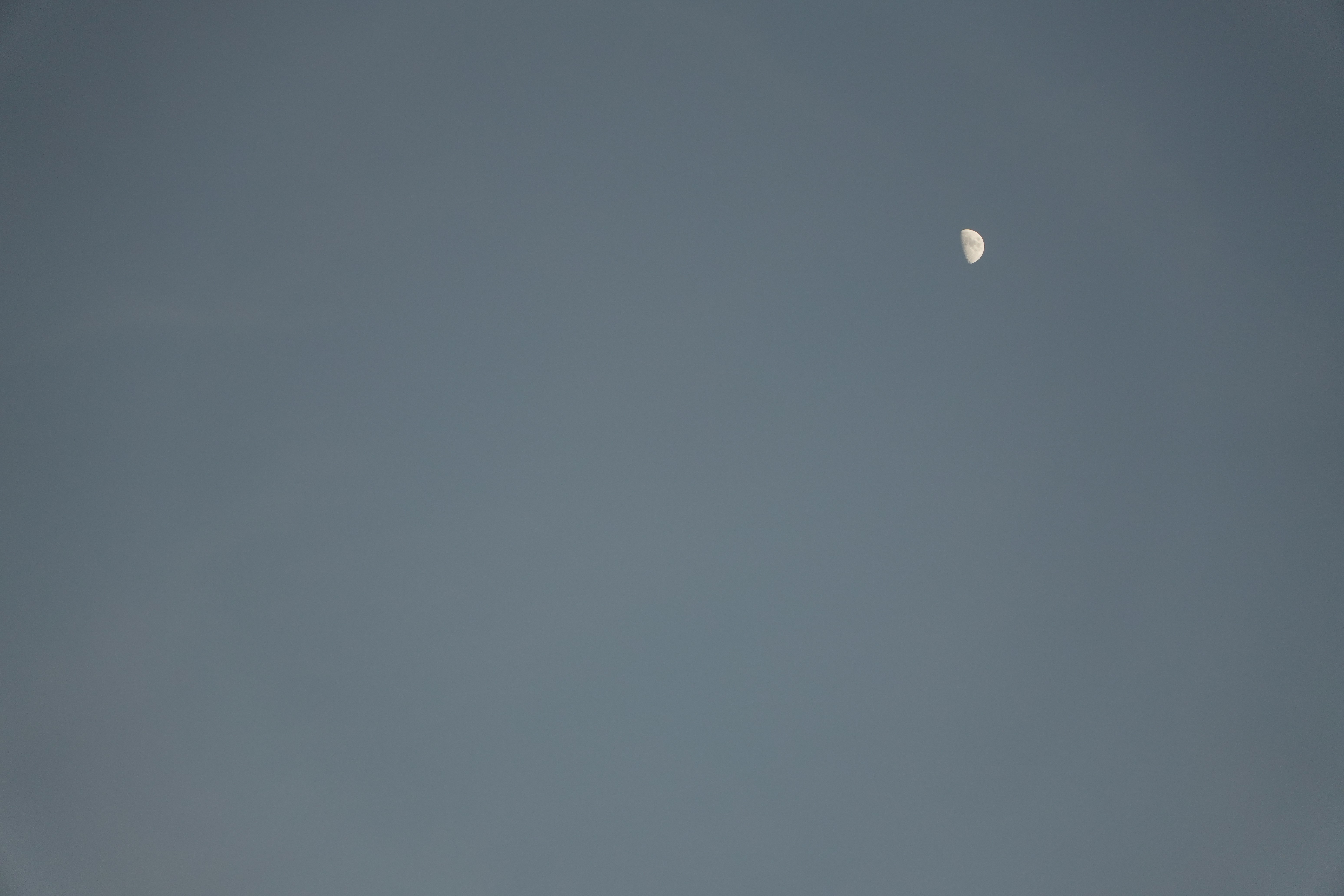 Lone Crescent: Moon in a Minimal Sky