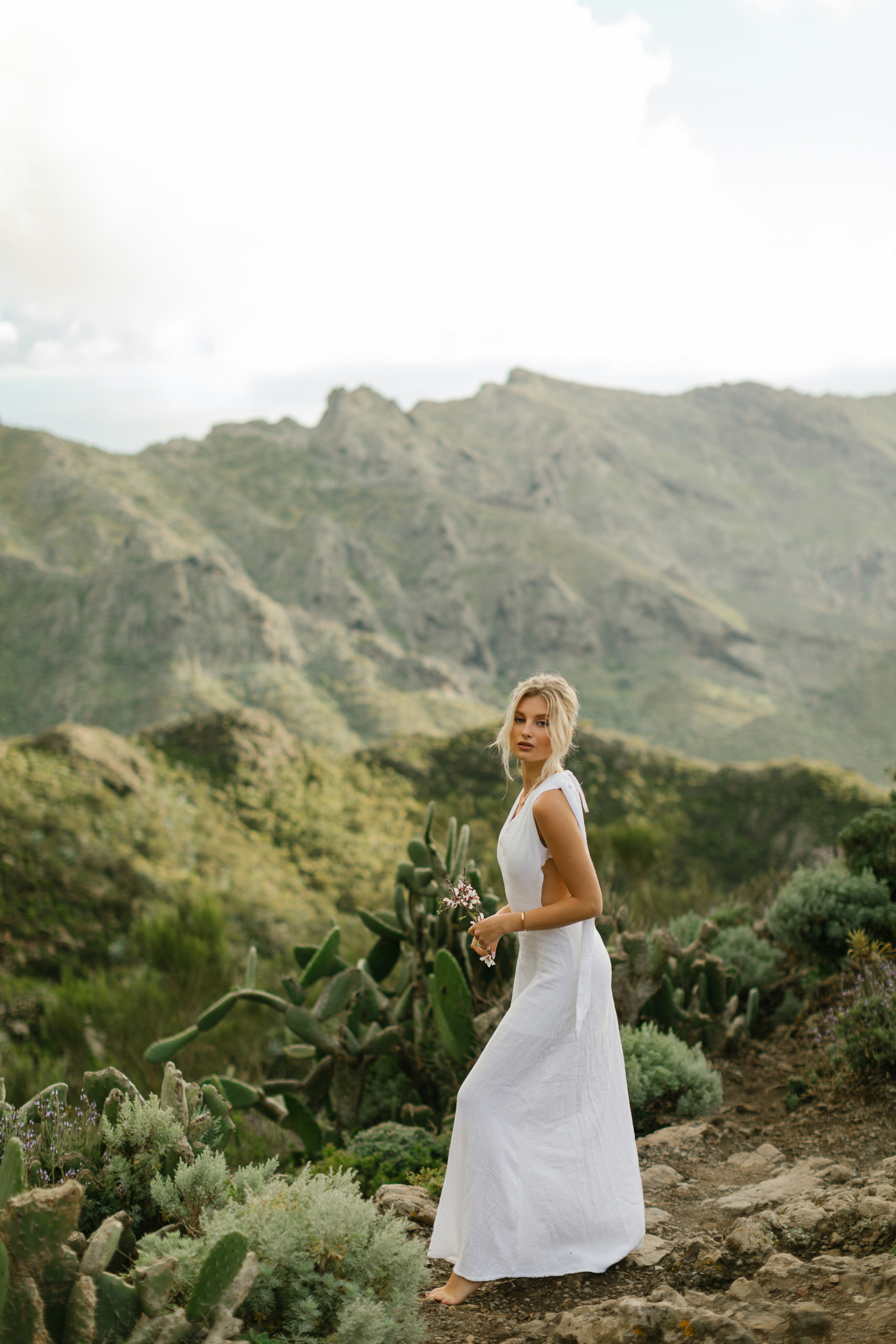 White-dress Wanderer Among Desert Blooms