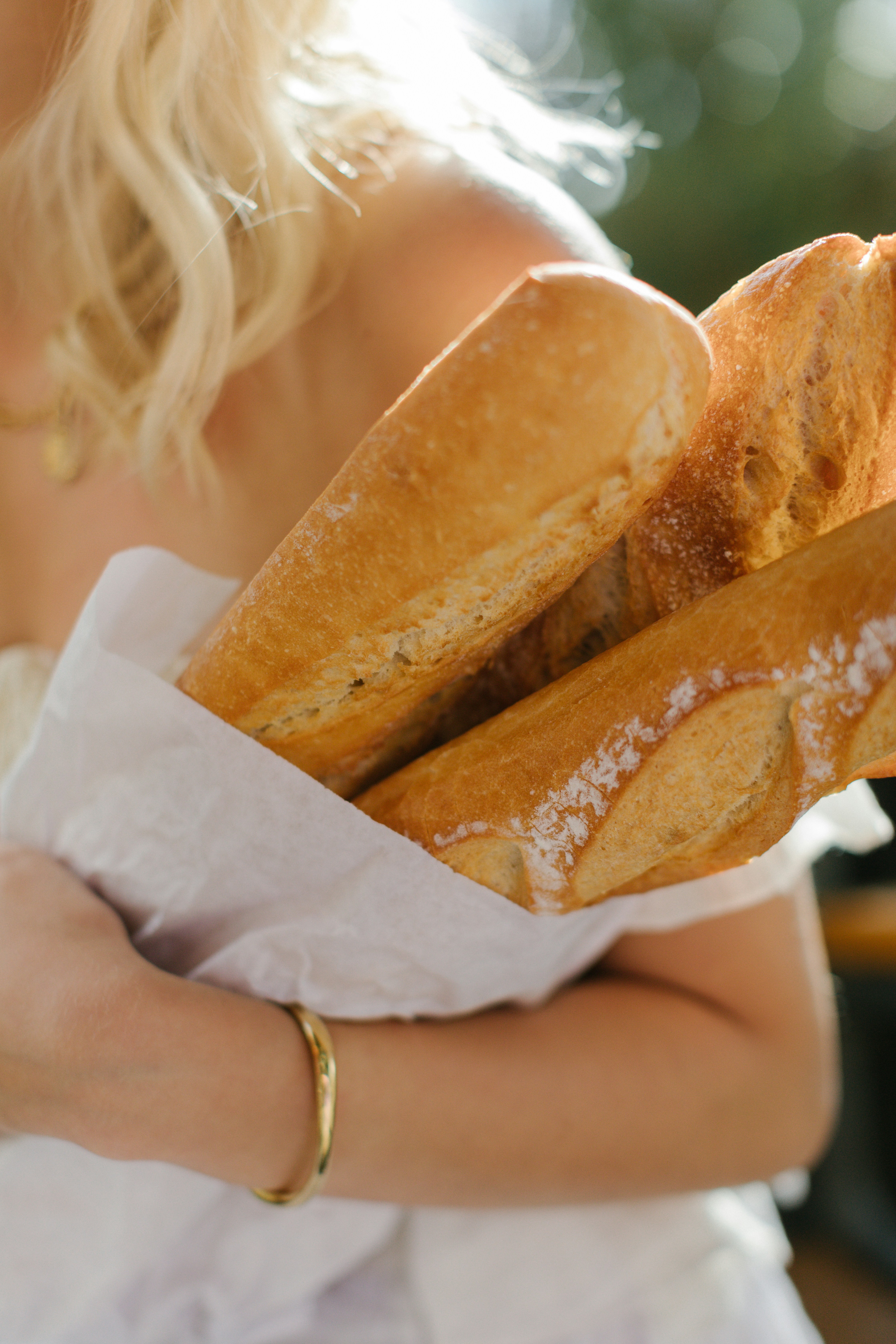 Golden Baguette Embrace: A Sunlit Lean of Crusty Freshness