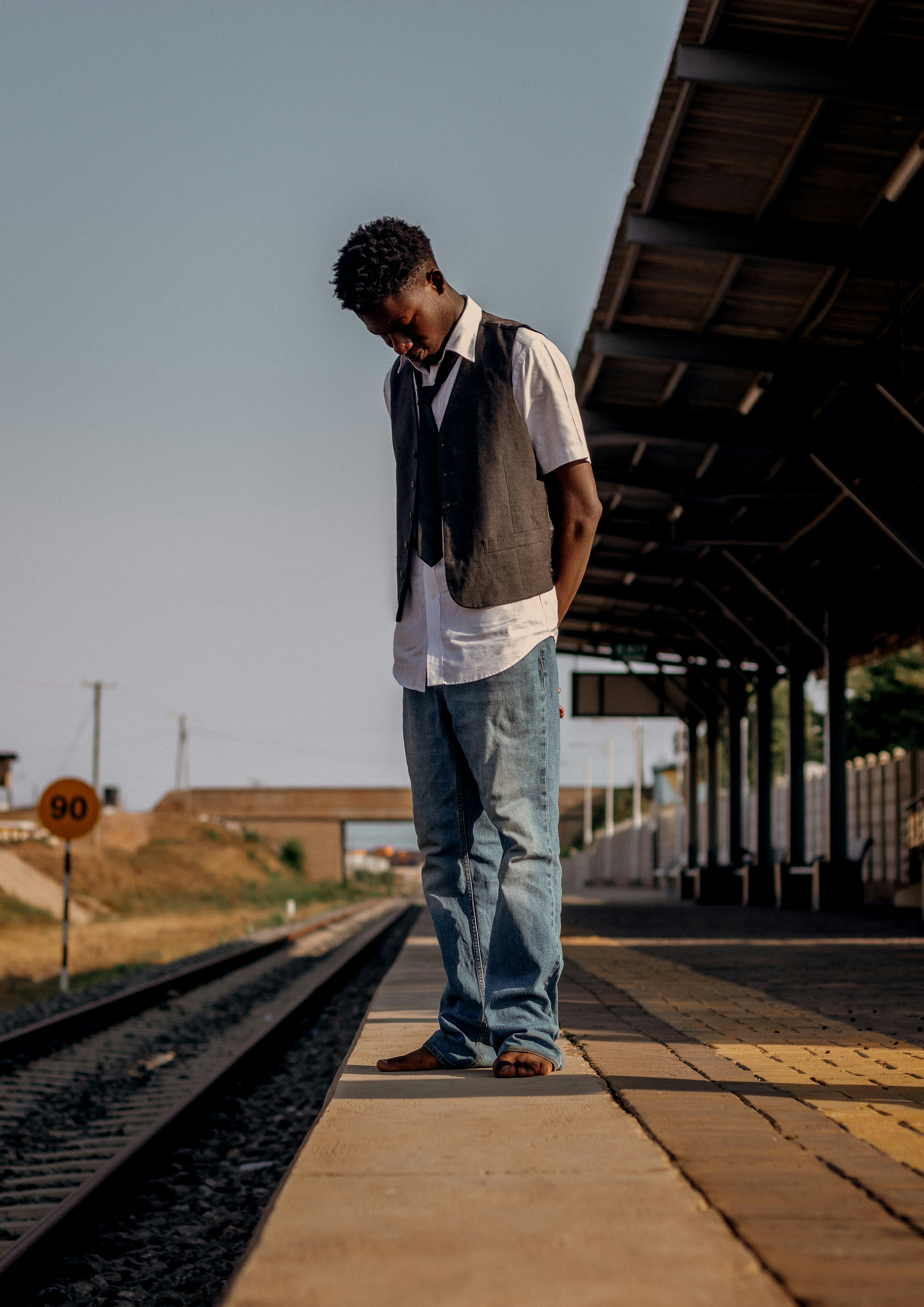 Youthful Stance at the Empty Platform