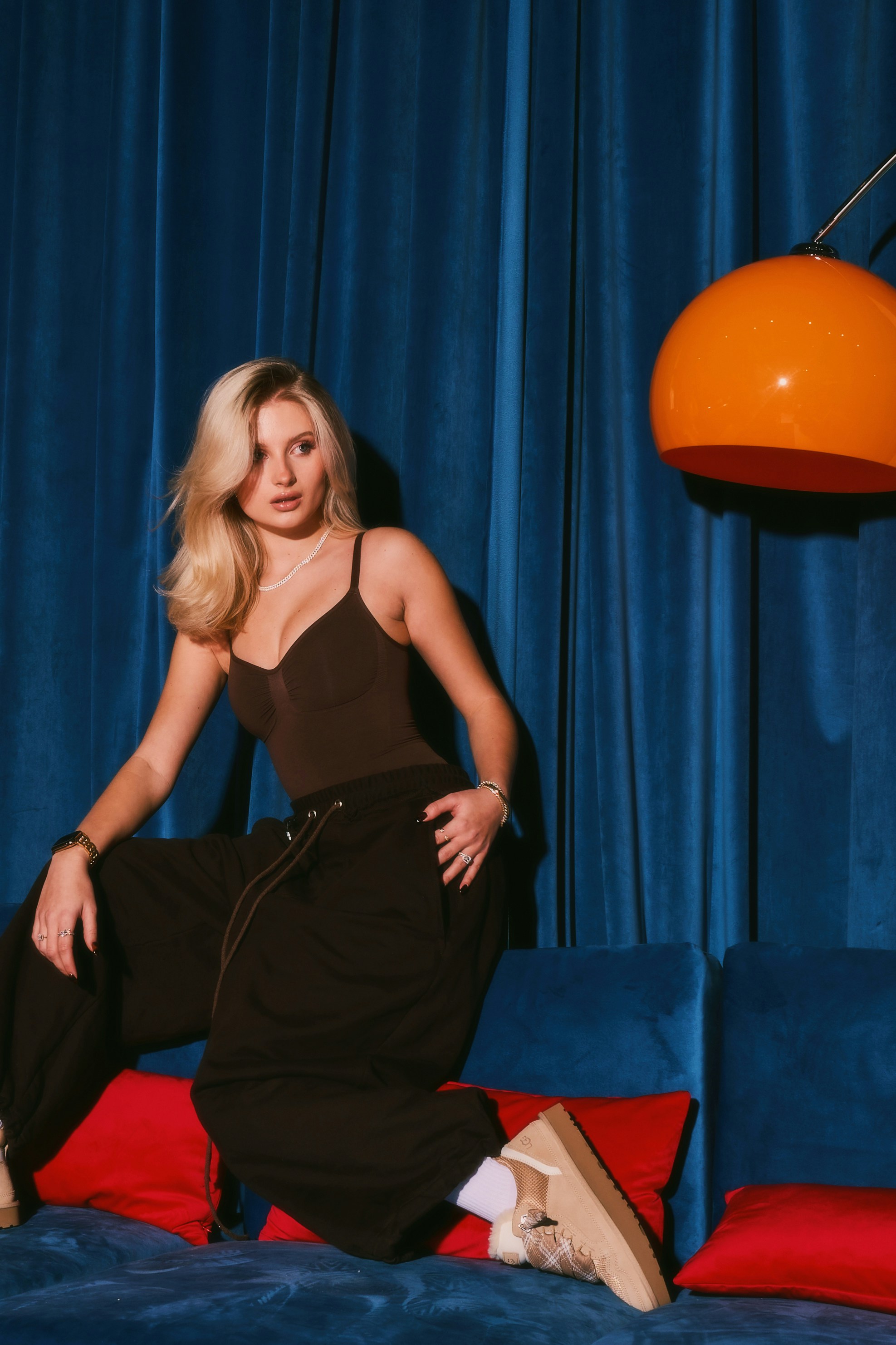 Blonde dusk: Lounge portrait against velvet blue backdrop