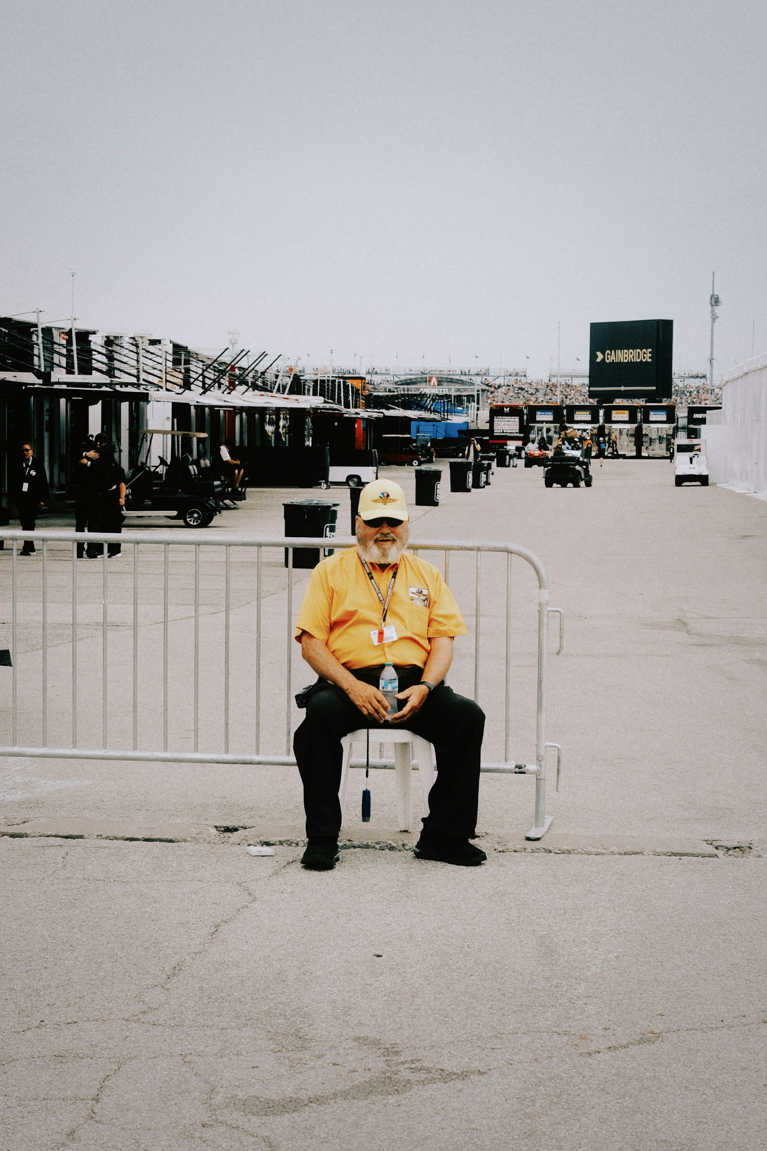 Guardian of the Fence: A Gentle Sentinel at the Pit Lane