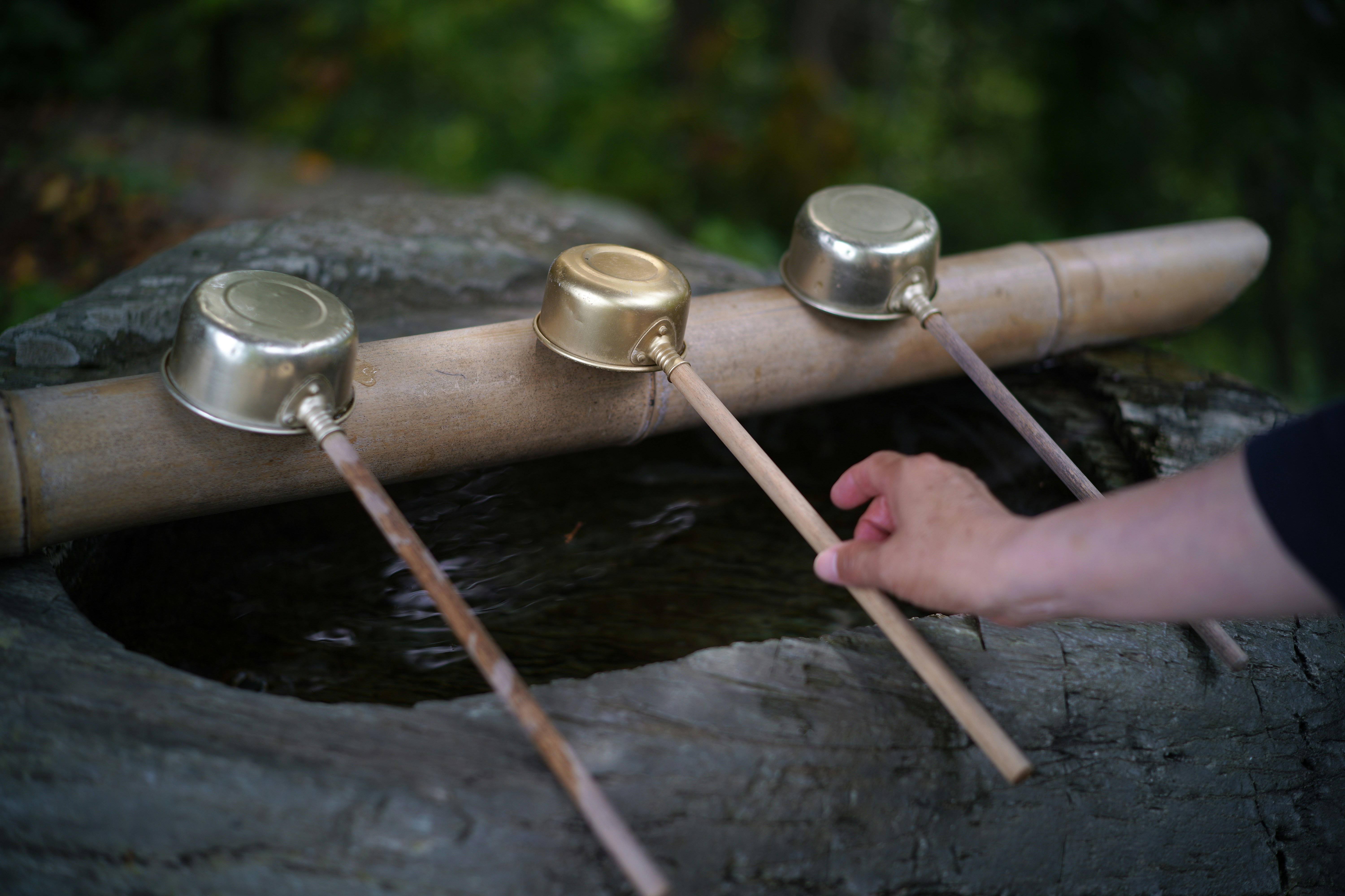 Hands on the Water-borne Drums: A Ritual of Pour and Pause