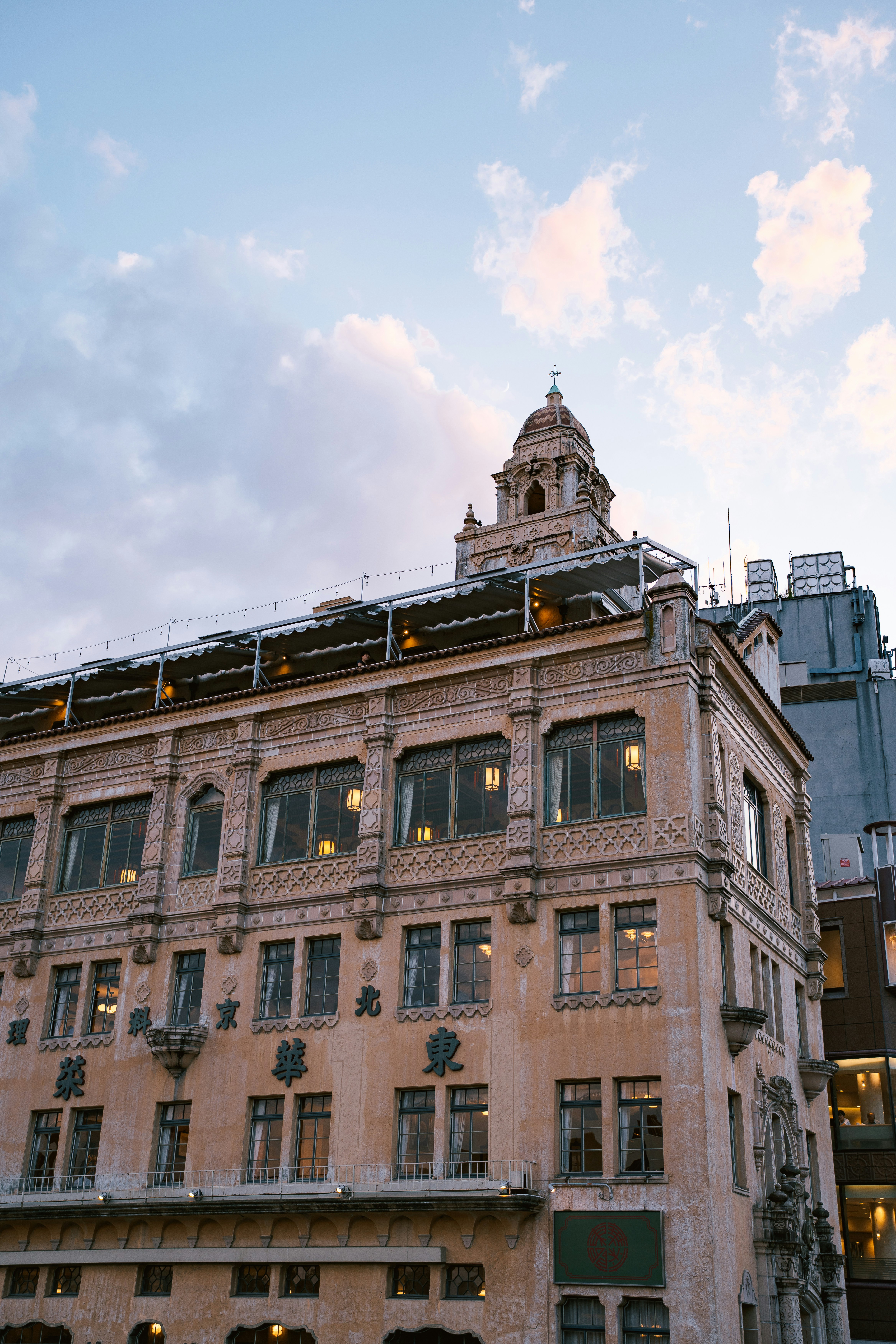 Ornate Facade Beneath a Sky of Soft Evening Light