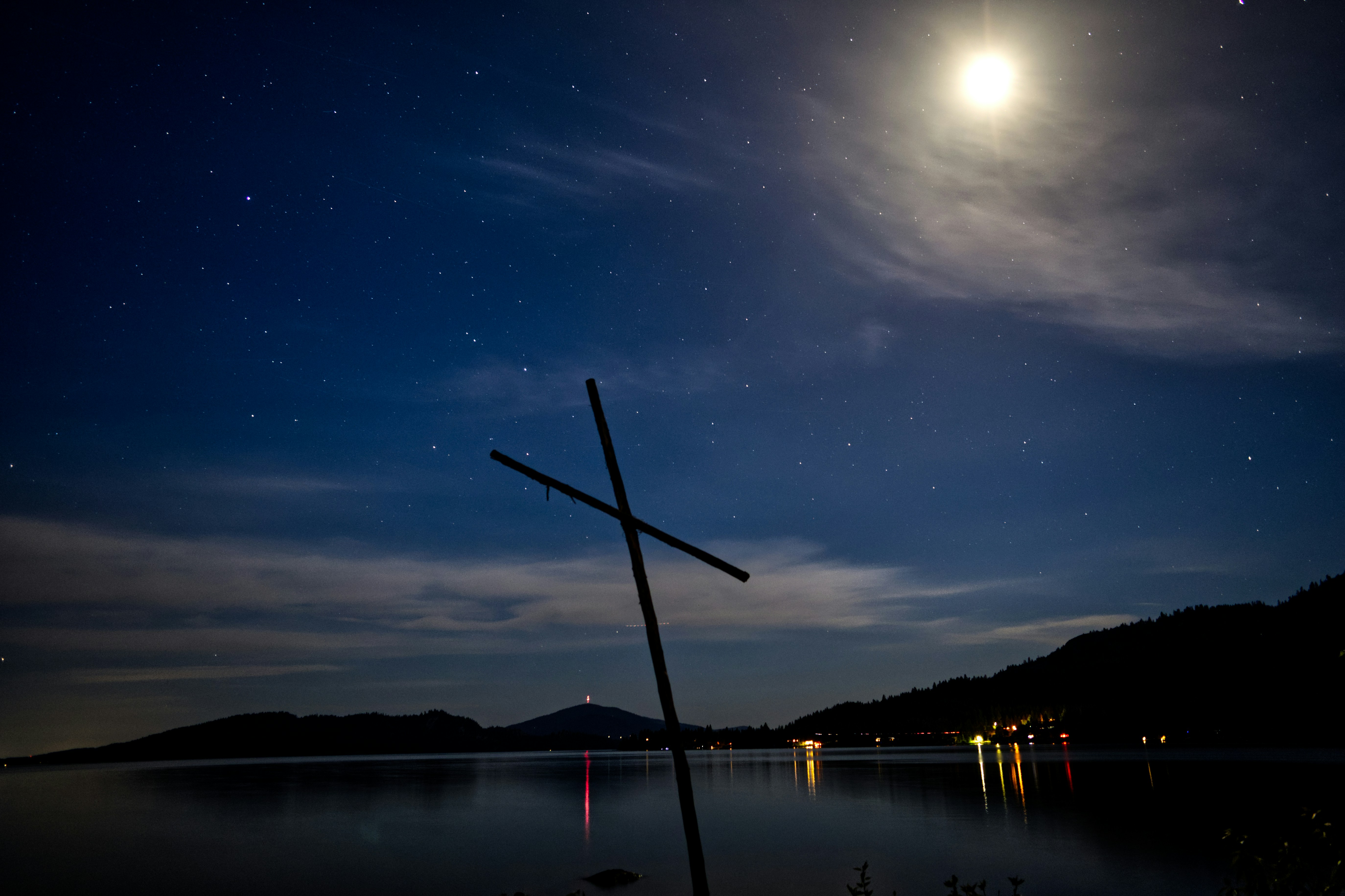 Moonlit Cross by the Quiet Lake