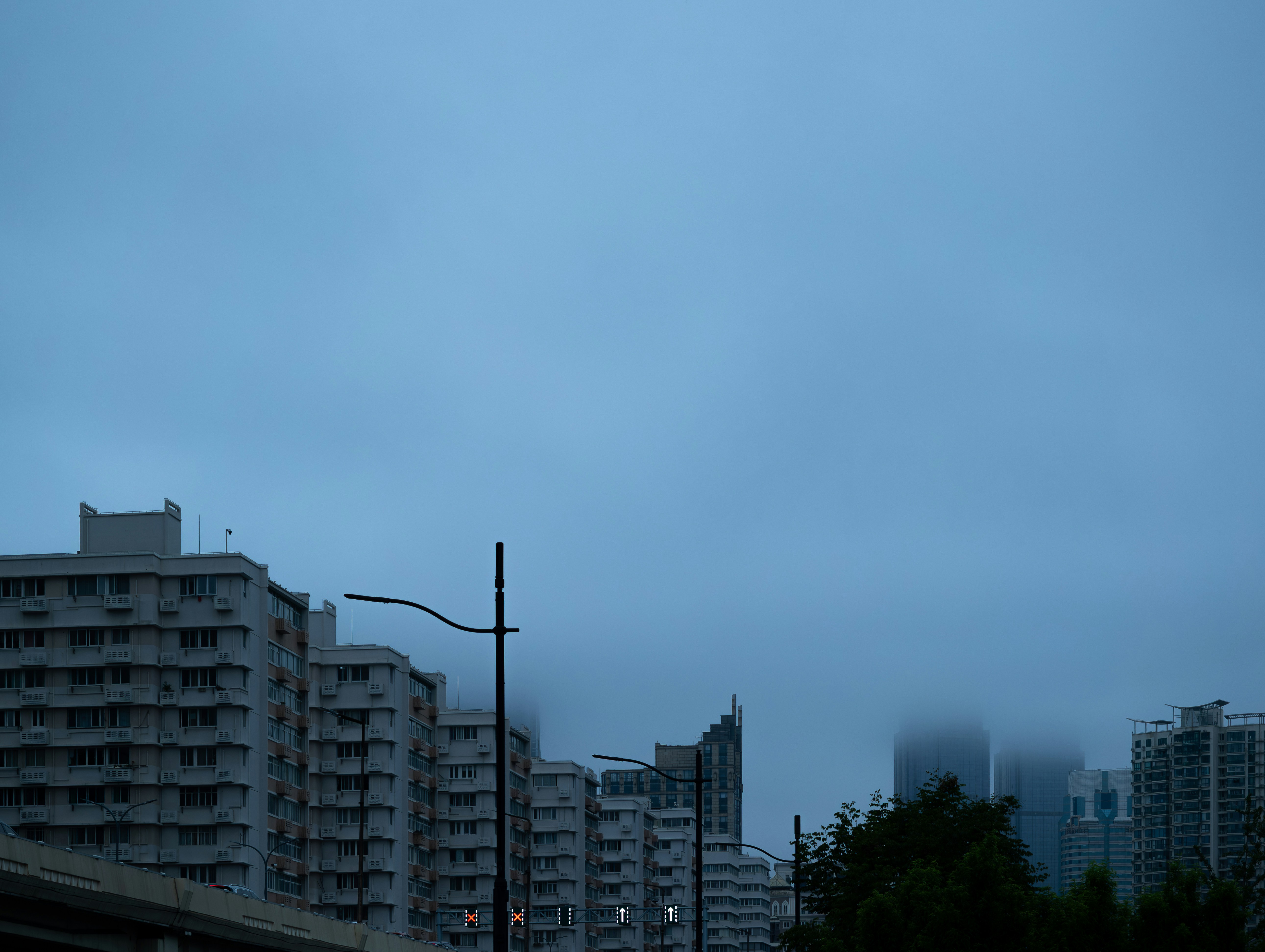 Urban Skyline Under a Low Clouded Canopy