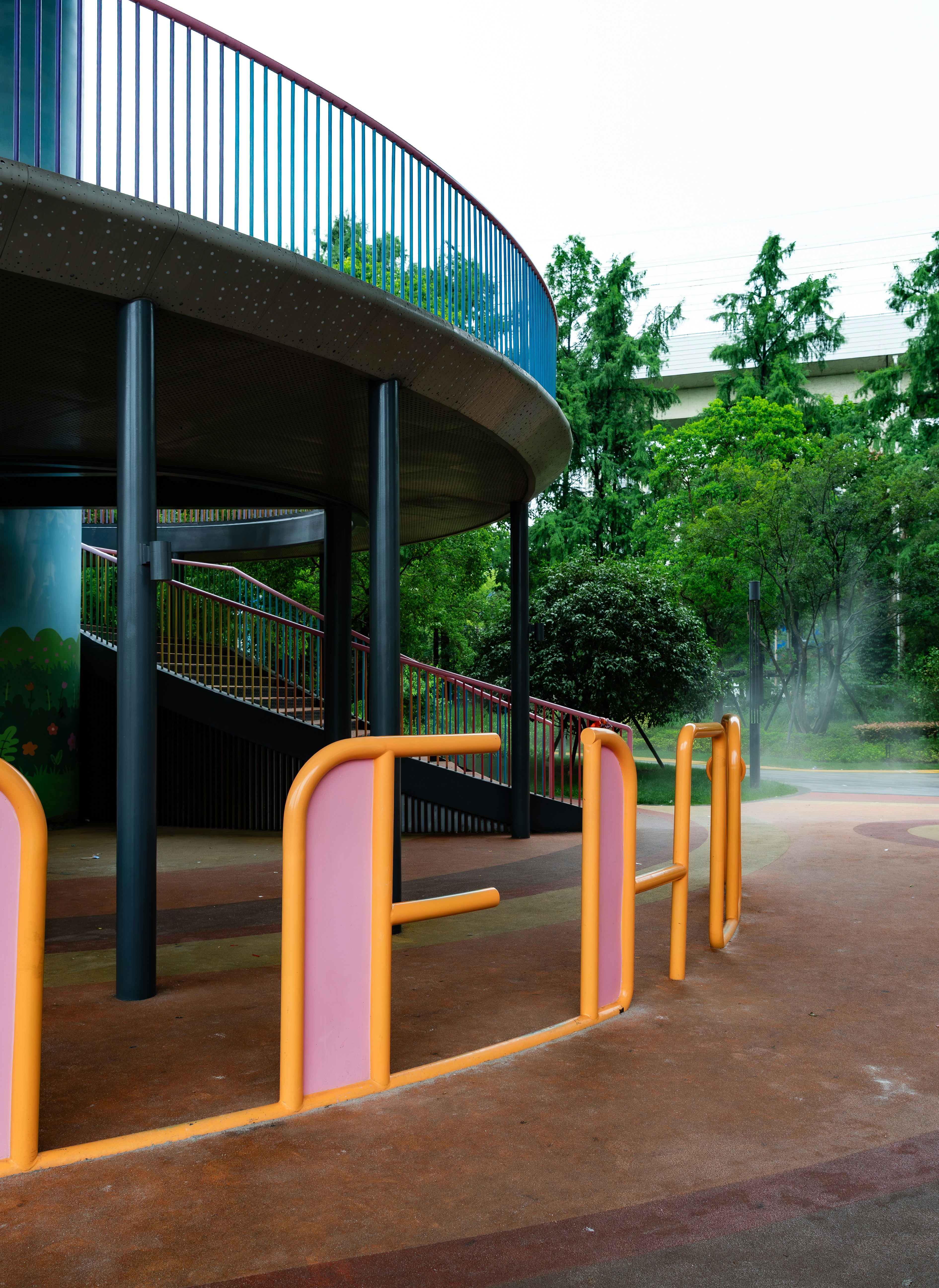 Curved Balcony Overlook with Bright Playground Barriers