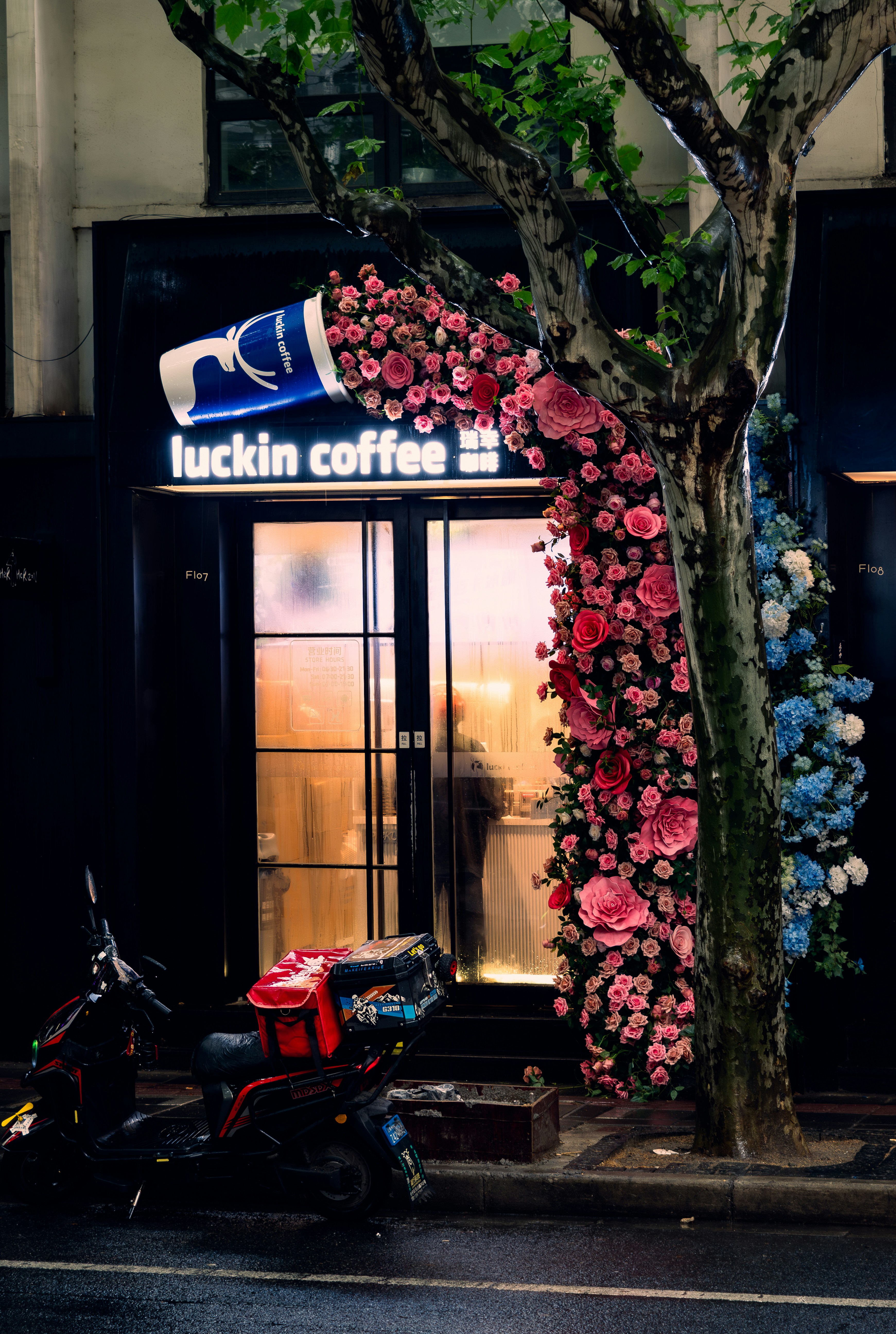 Floral Arch Framing a Coffee Shop Entrance
