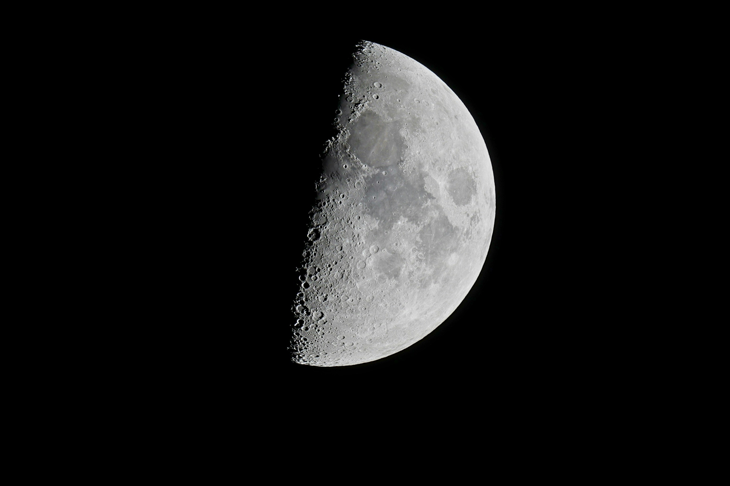 The Lunar Edge: Half Moon in a Velvet Void