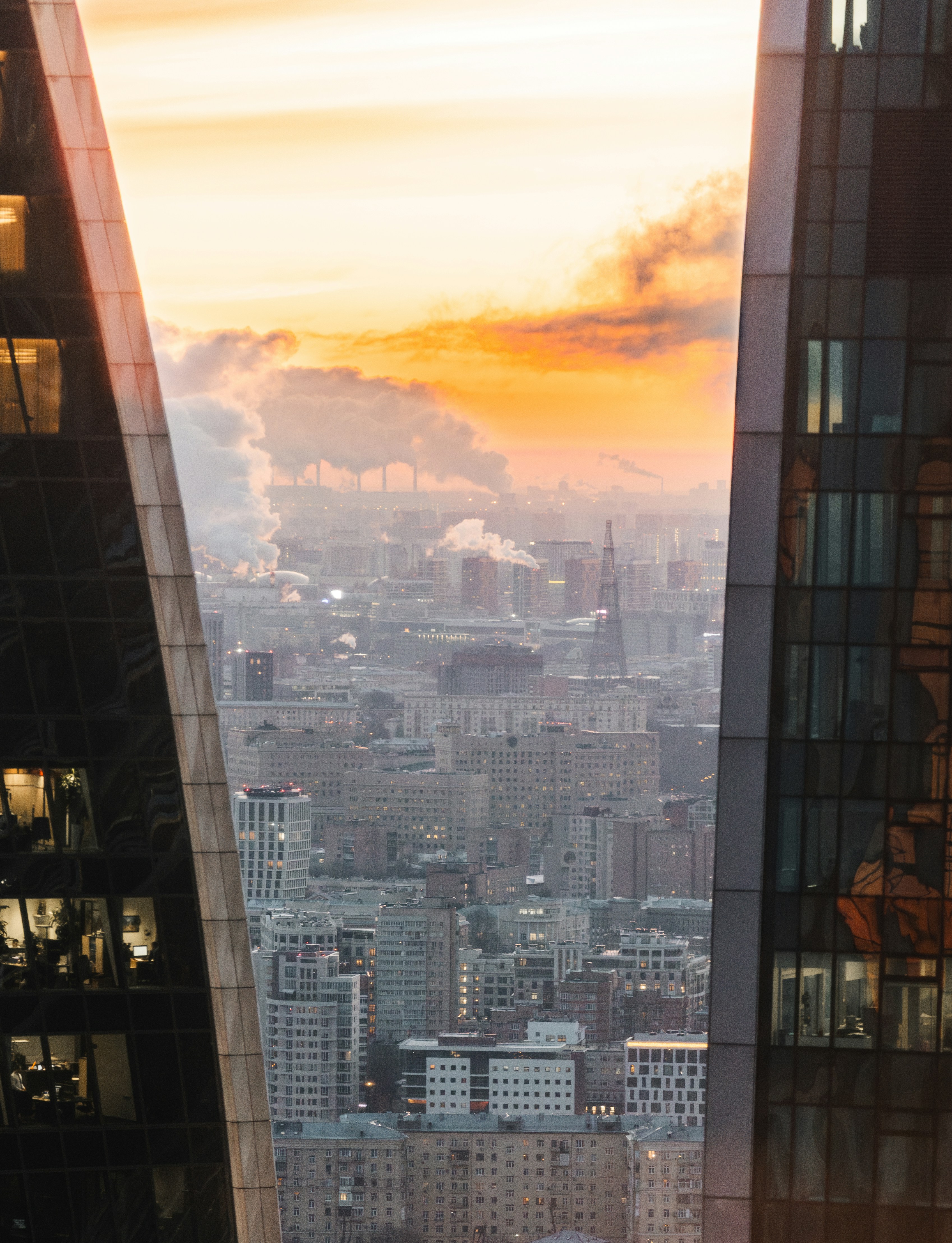 Framed Skyline Between Glass Giants at Sunset