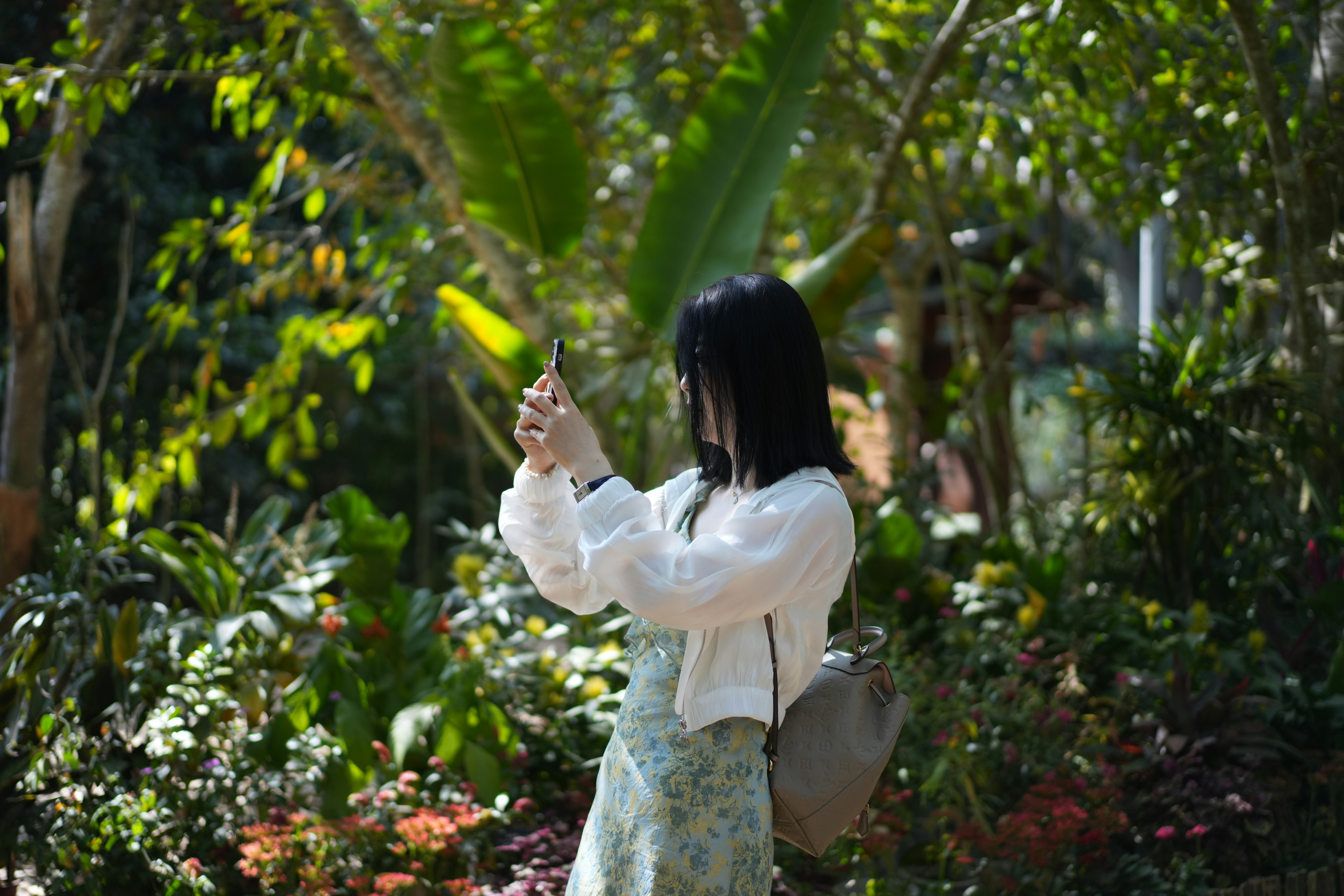 Selfie in the Dappled Garden: A Quiet Moment with Colorful Flora