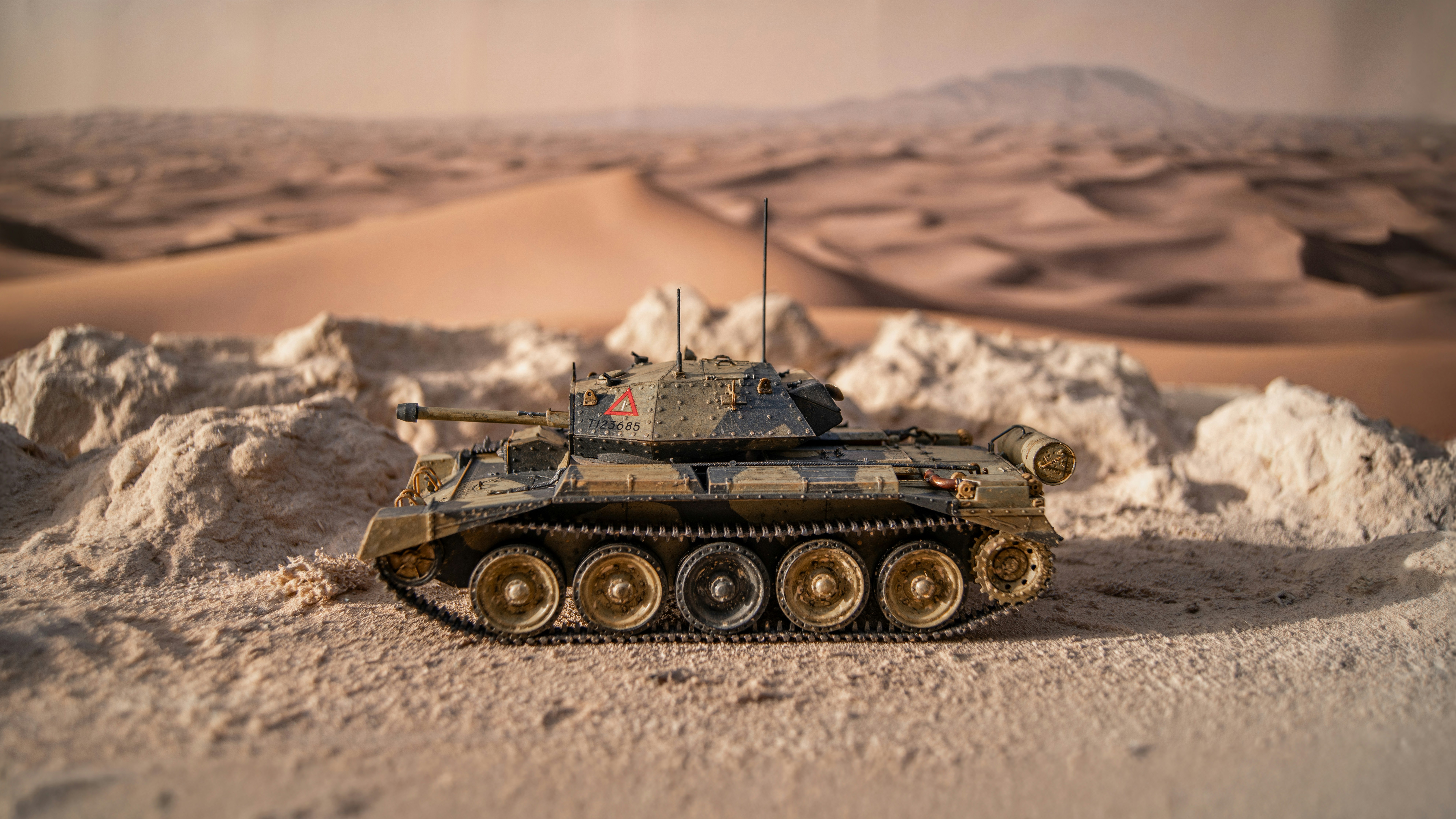 Desert Armor in Focus: A lone tank on wind-sculpted dunes