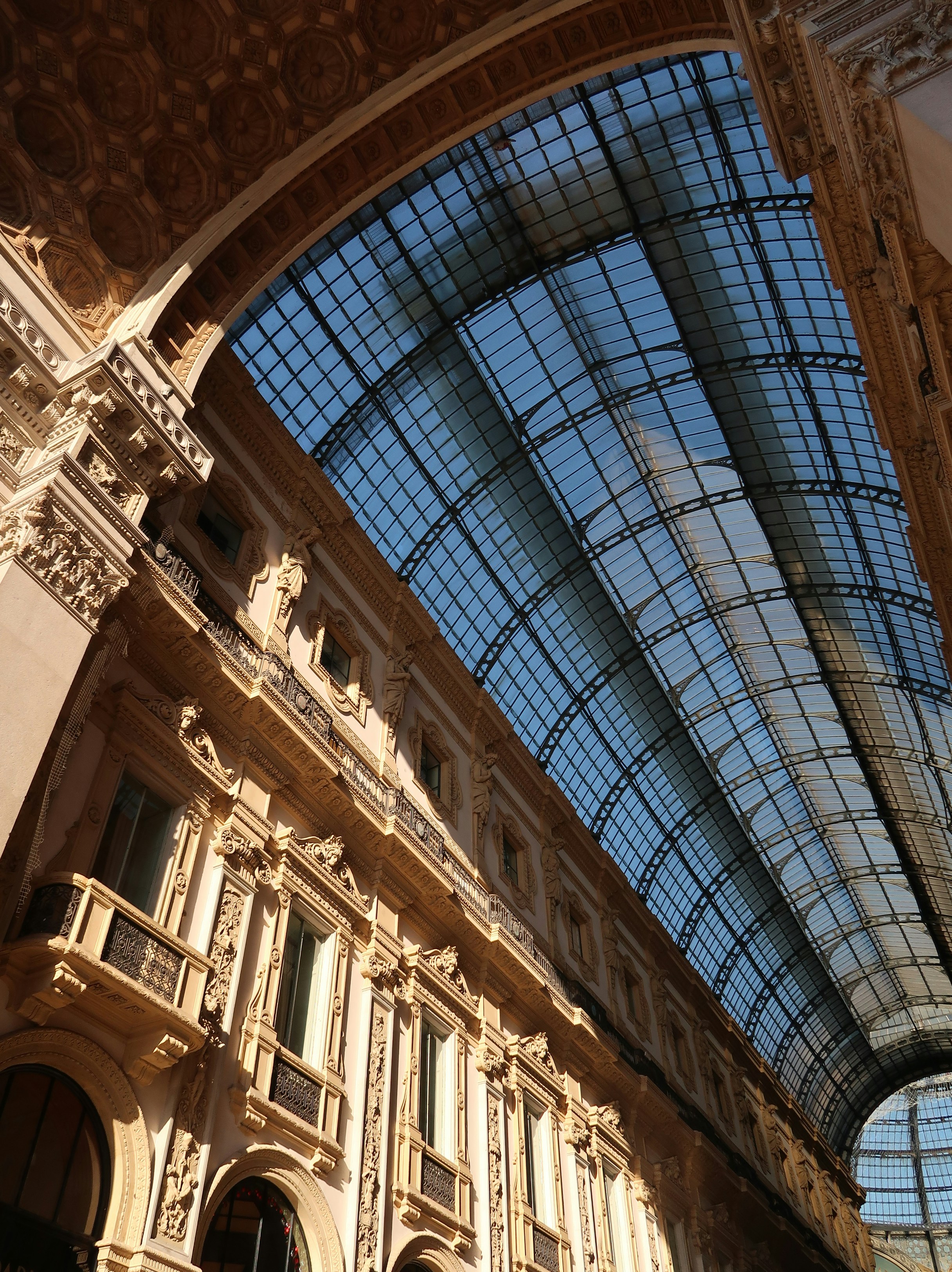 Glass Vaults and Ornate Facades: A Sunlit Interior of Grandeur