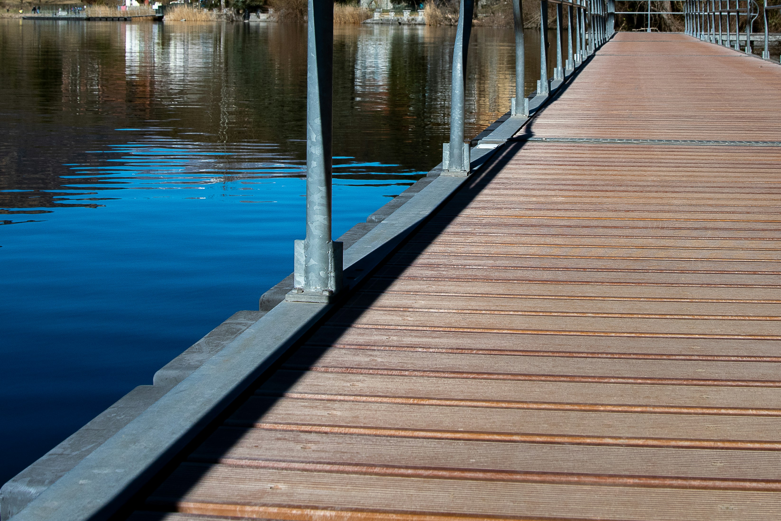 Wooden Dock Converging Lines toward a Quiet Horizon