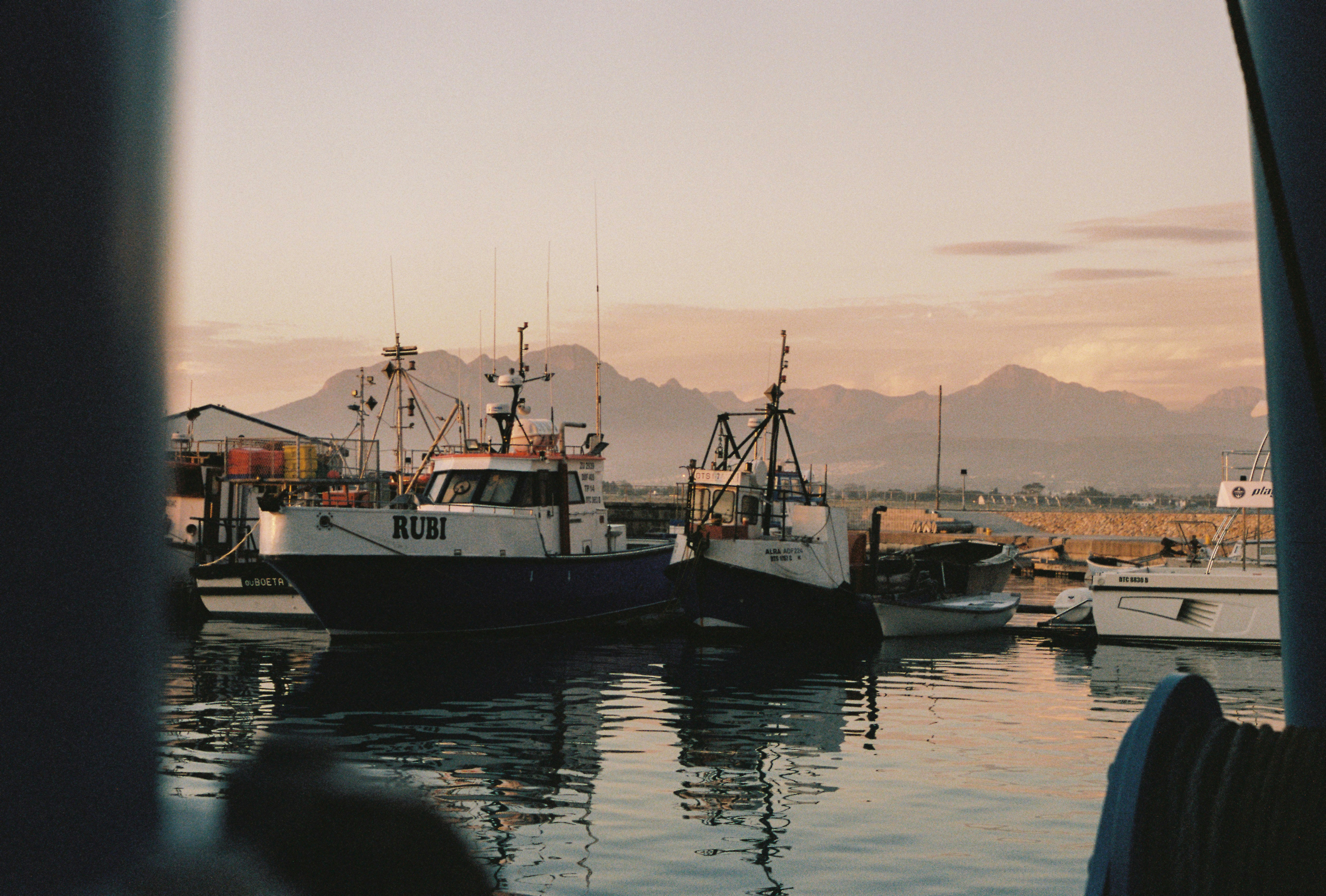 Harbor Stillness: Boats Quietly Rest at Dusk