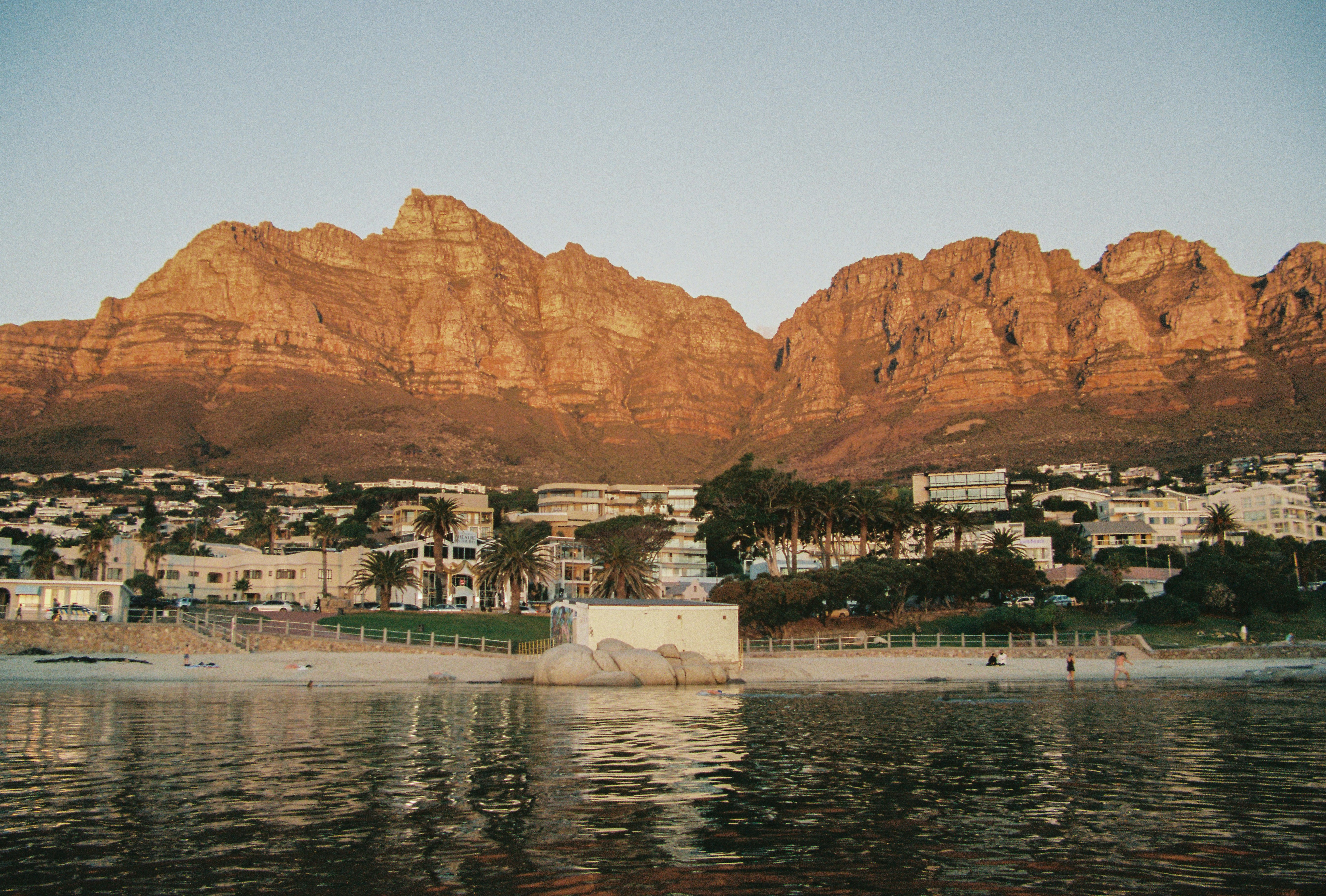 Rugged Range Overlooking a Quiet Beach Town at Dusk