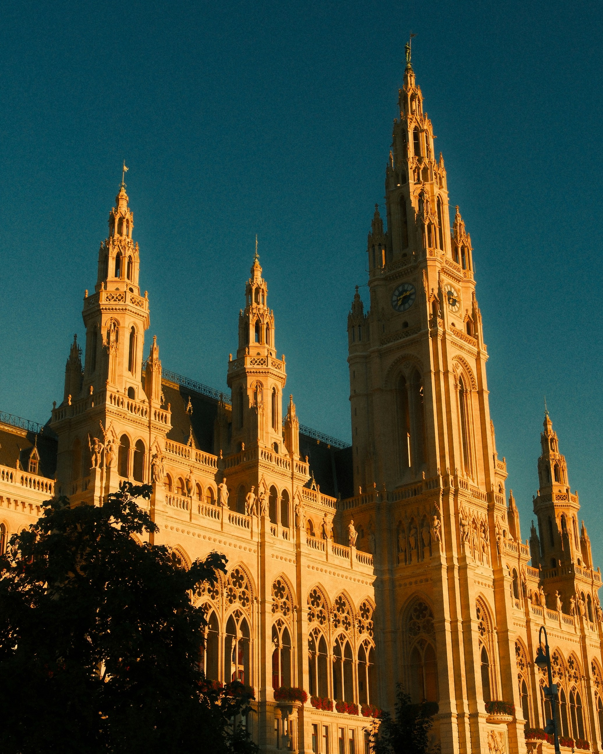 Sunlit Neo-Gothic Spires Rise Over a Fortress-like Facade