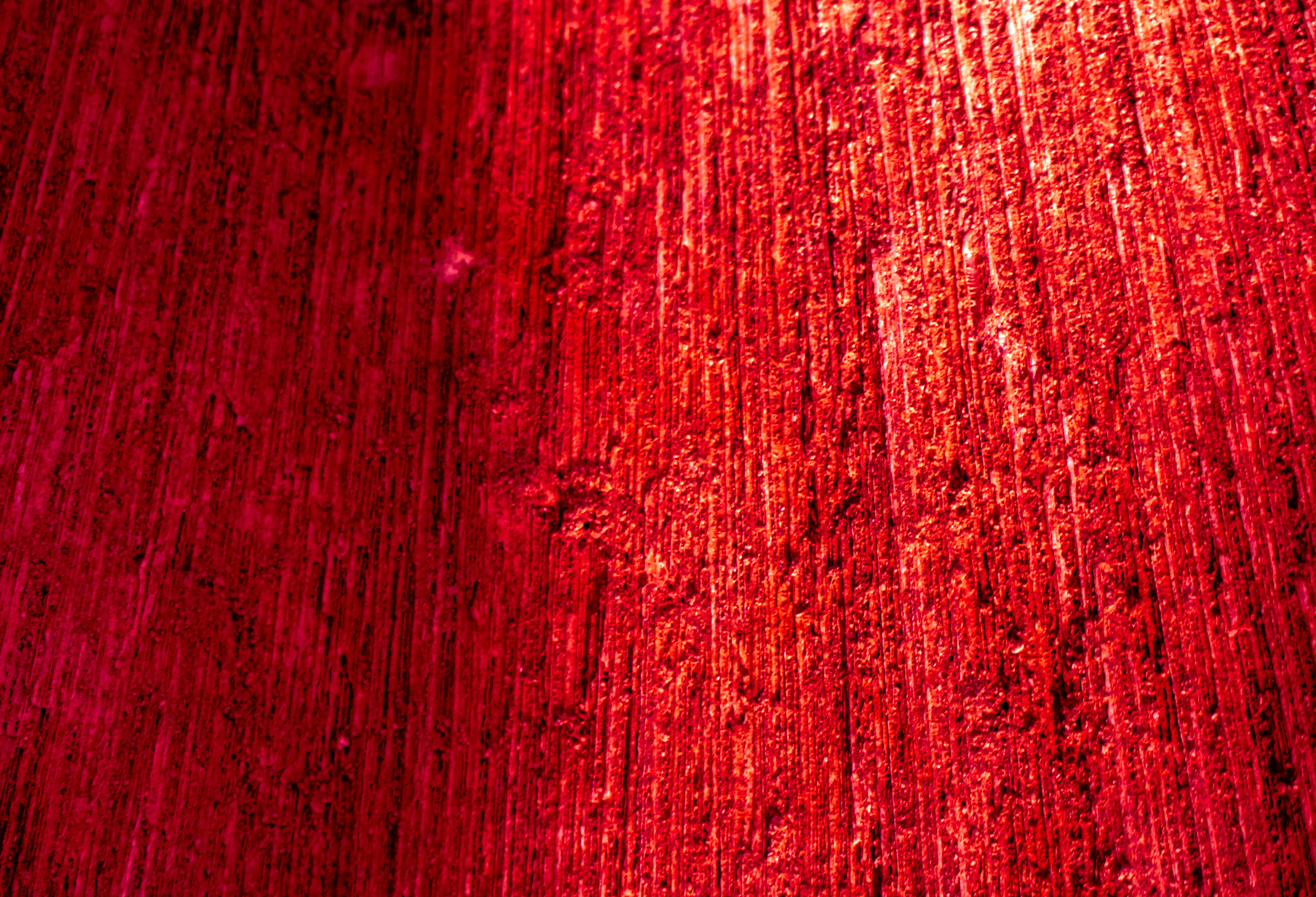 Crimson Grain: A Close-Up of Weathered Wood Textures