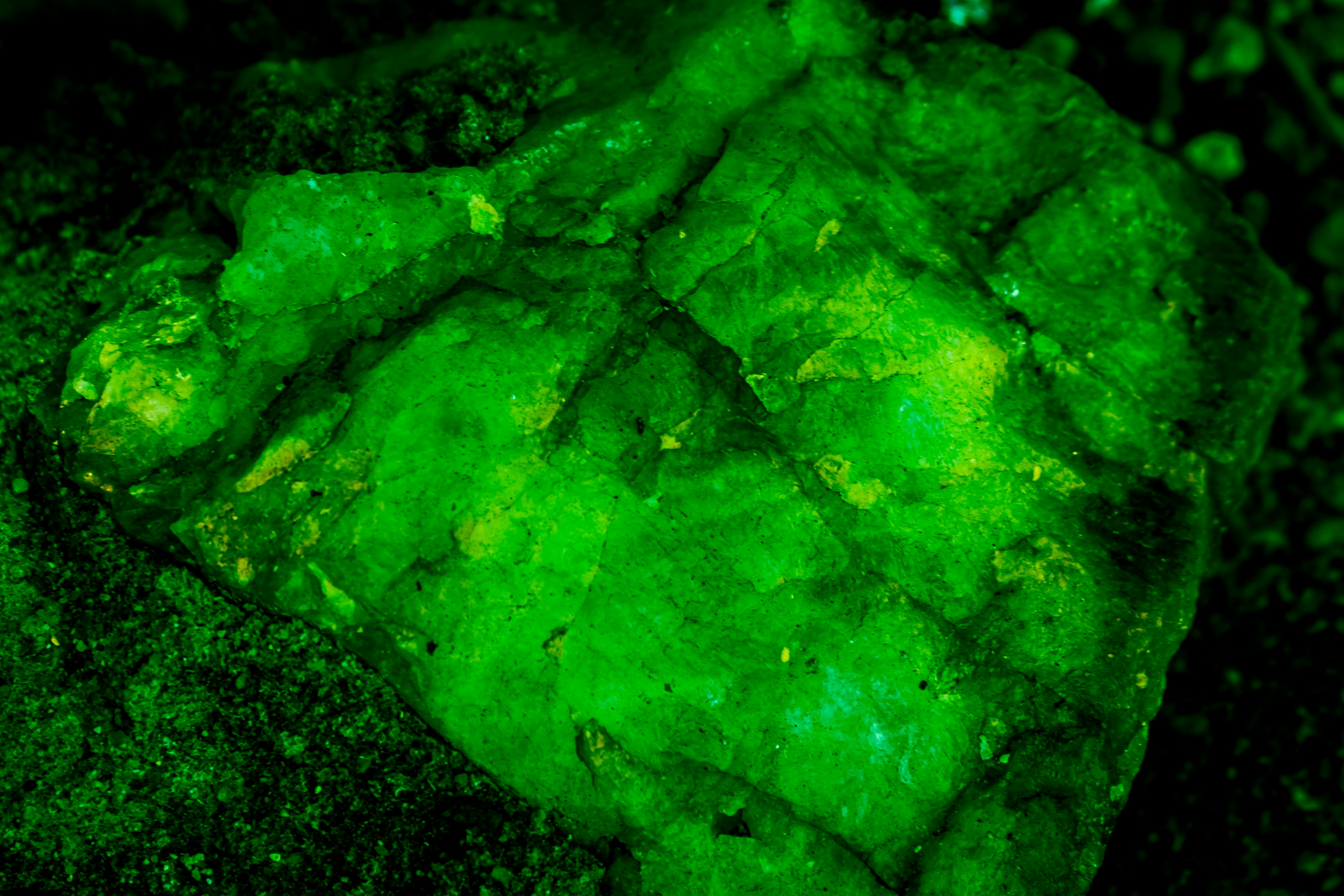 Glowing Green Mineral Veins Under Close, Macro Light