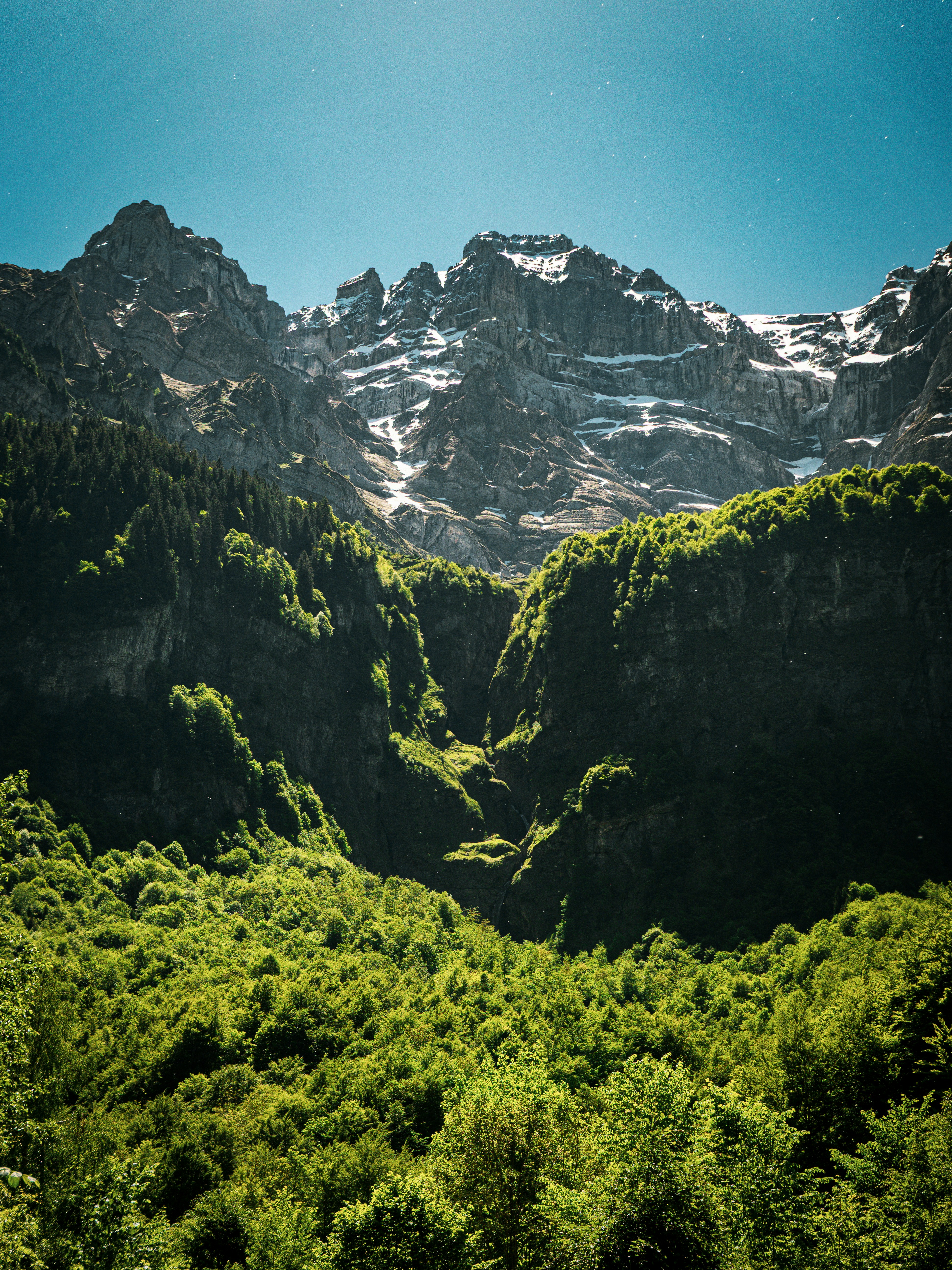 Snow-kissed Peaks Above a Verdant Valley