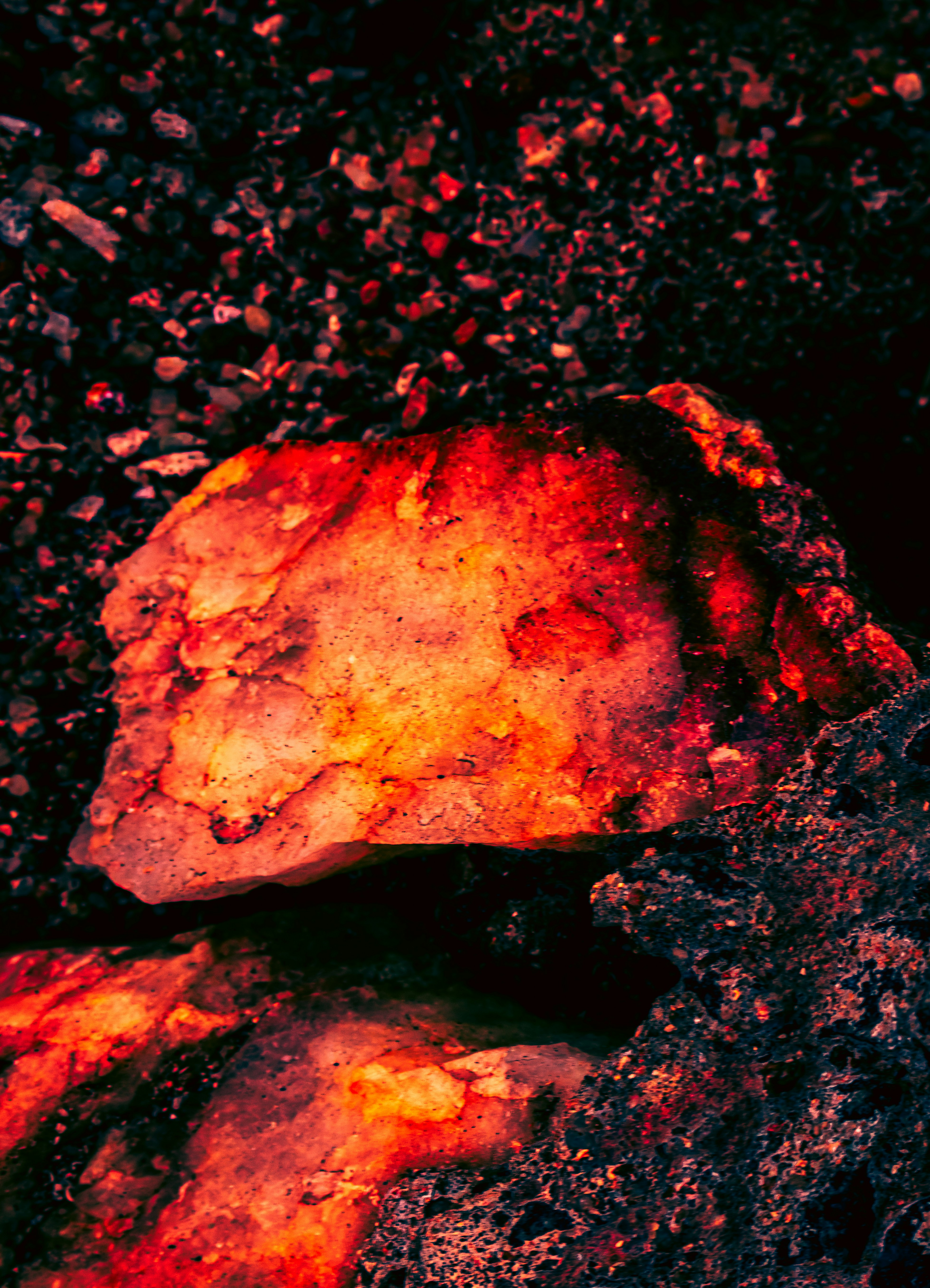 Crimson Edge: A Glowing Rock Ember in Dim Earth