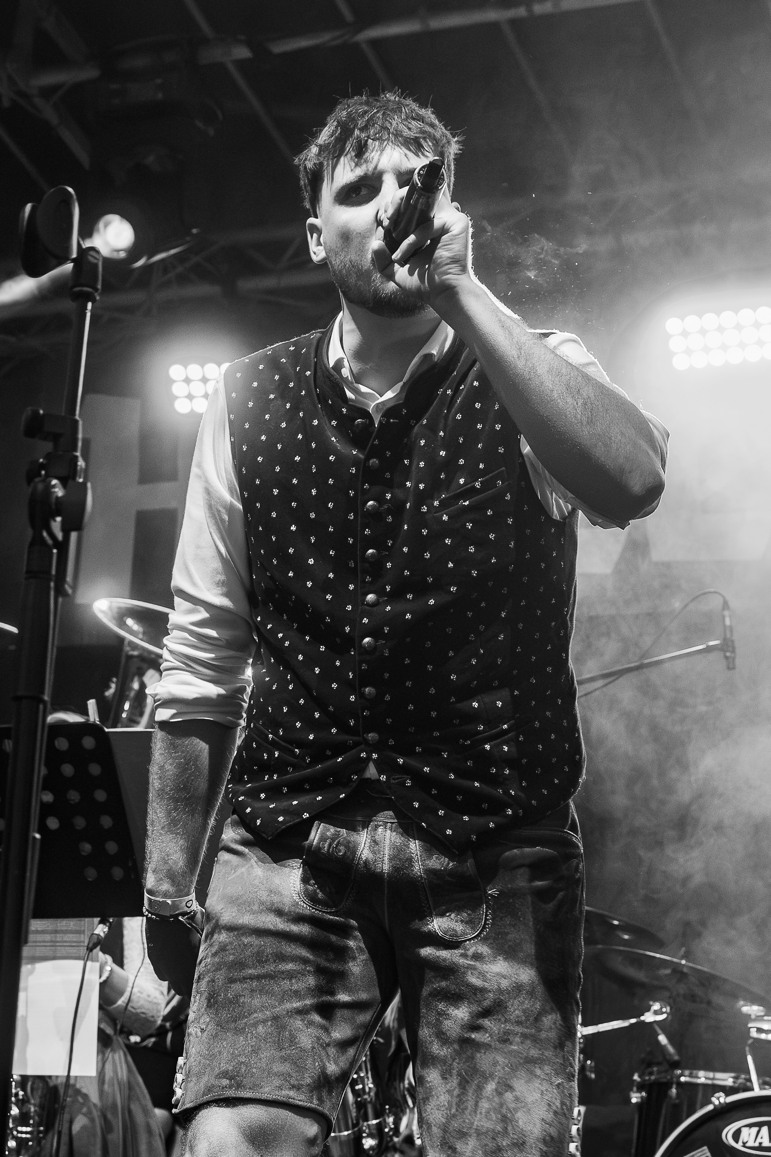 Center Stage Verve: A Vocal Moment Understage Lights