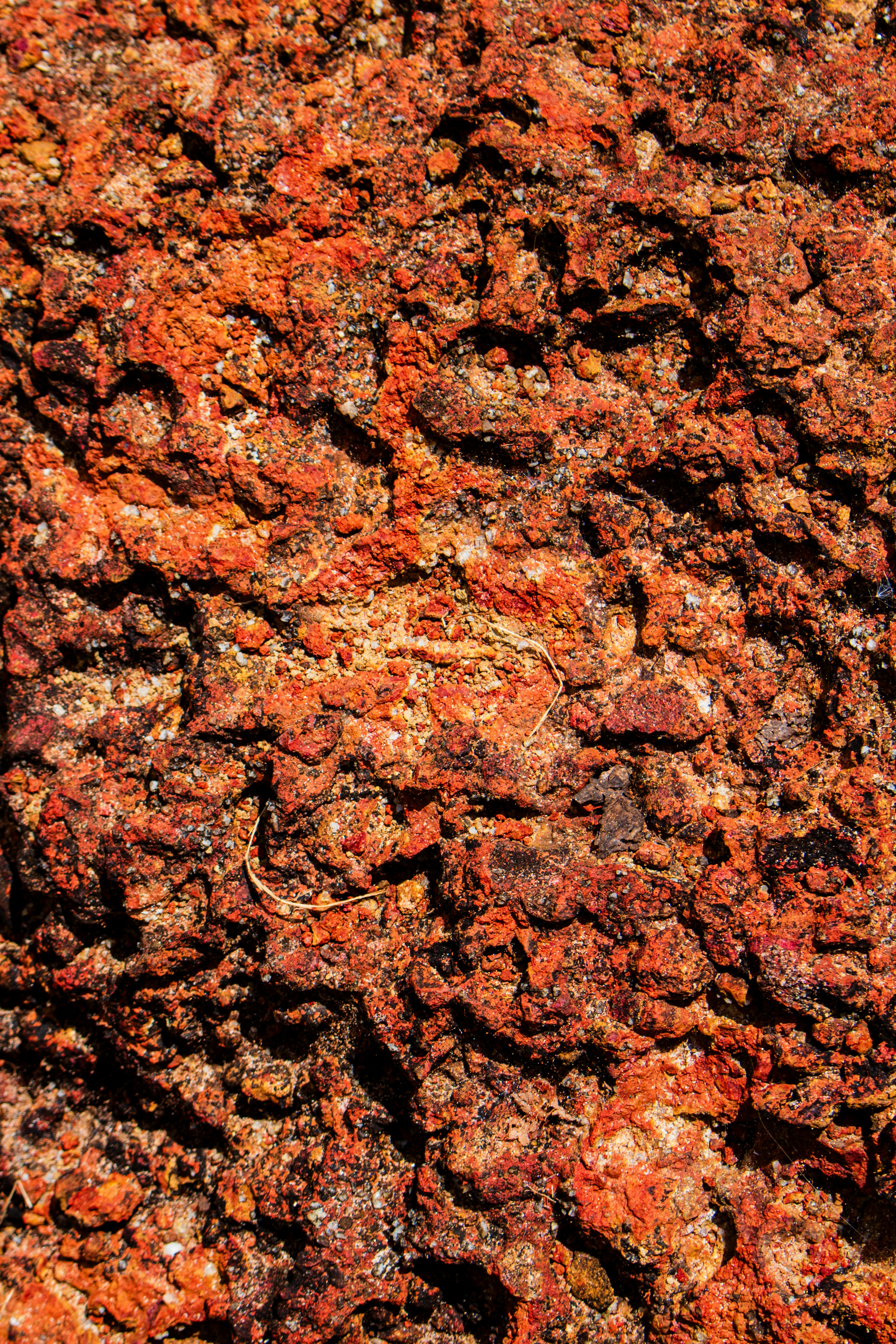 Rugged Red: Crumbling Volcanic Terrains in Macro Detail