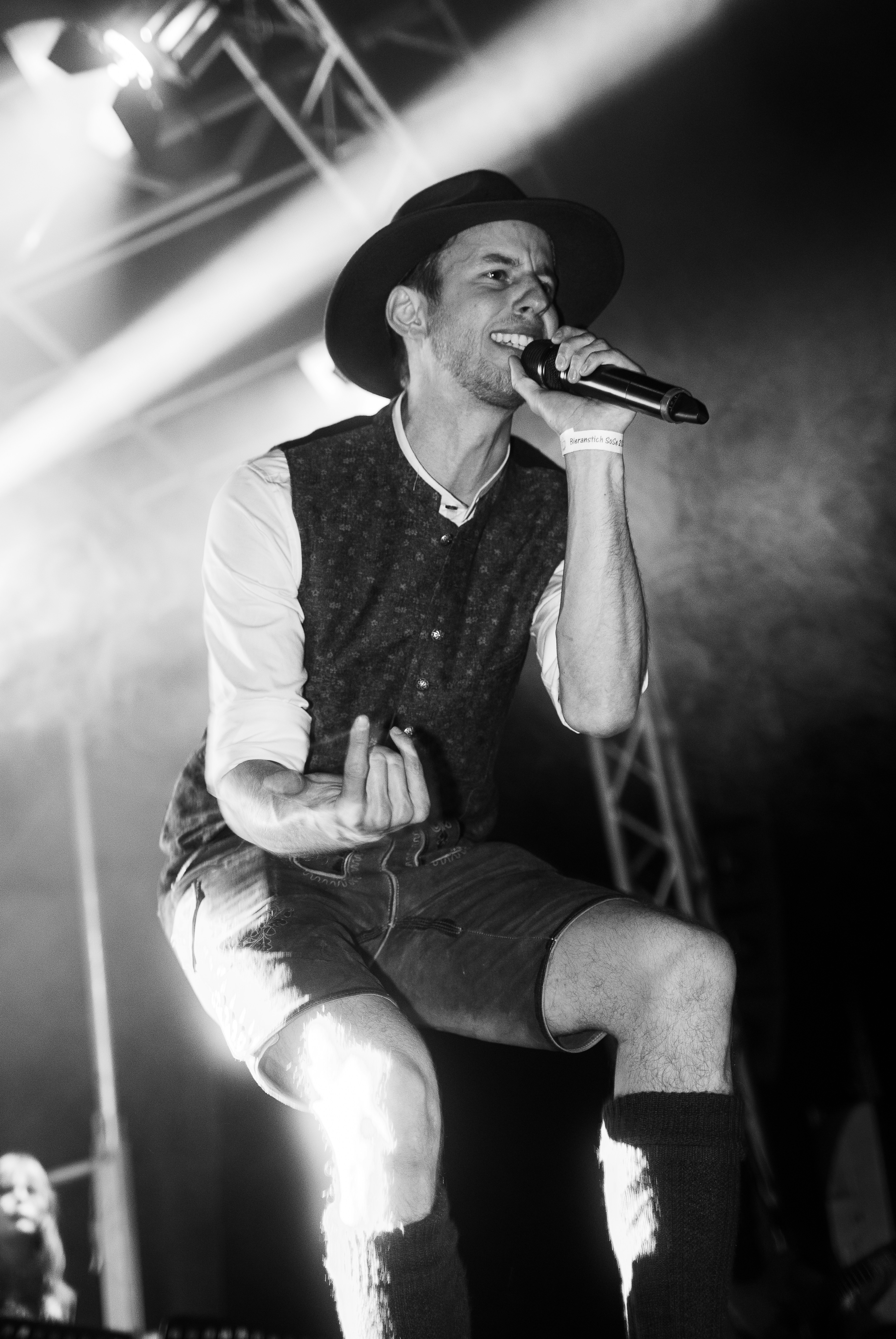 Mid-Stage Mojo: A Vocalist in Motion Under Stage Lights