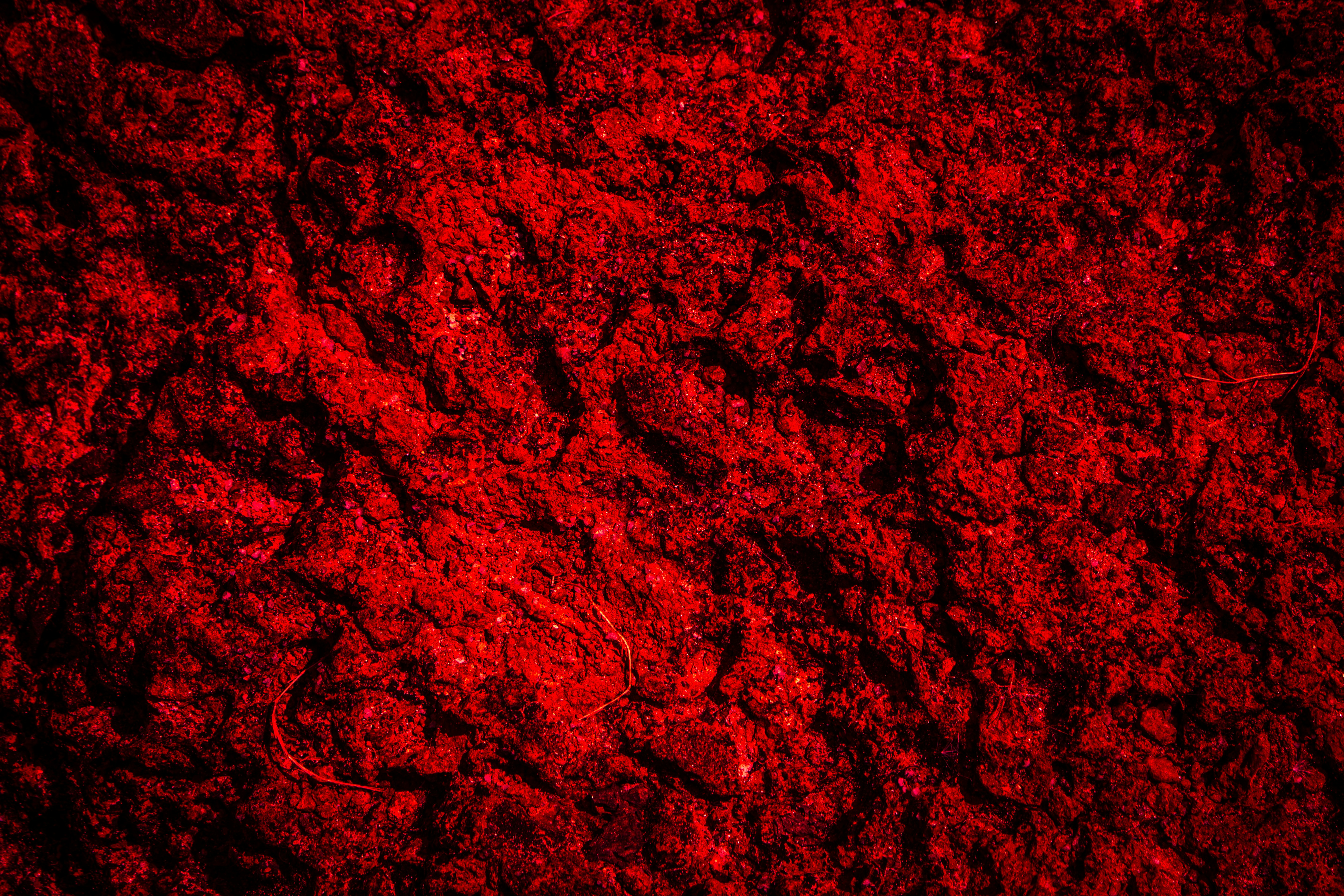 Crimson Veil: Close-Up of Textured Earthy Red Surface