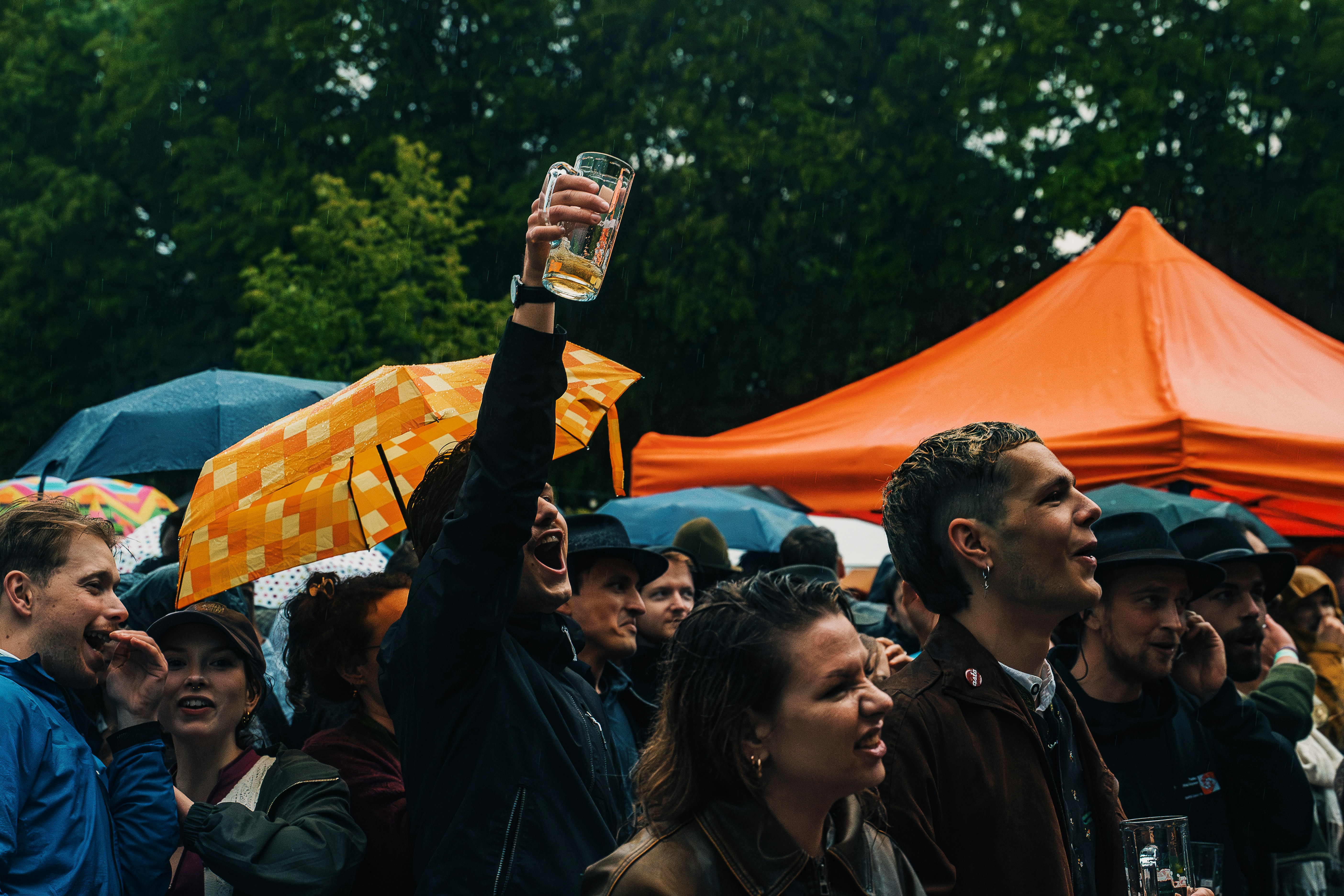 Crowd Cheers Under Bright Tents at a Weekend Festival